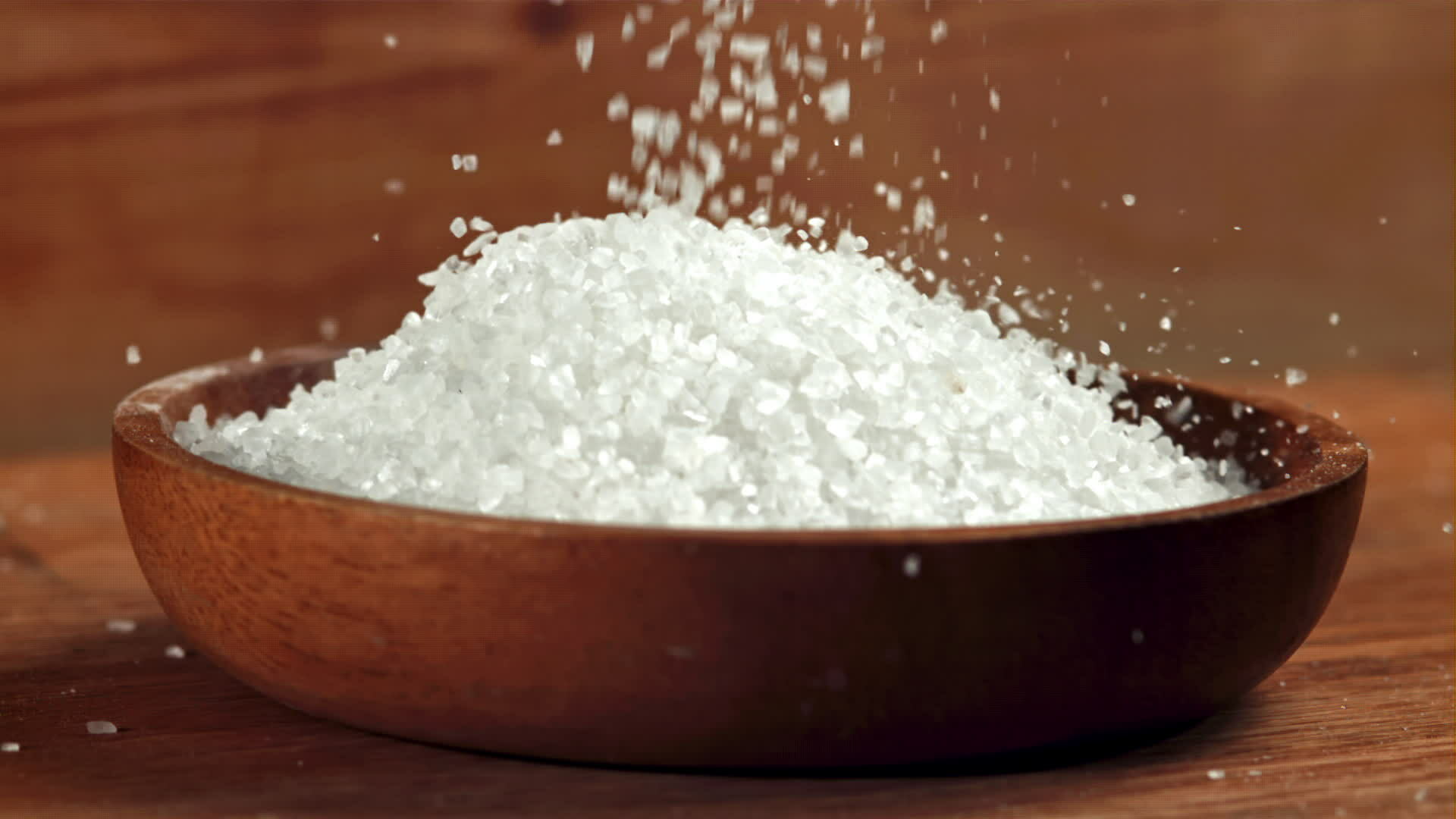 Salt Falls Into A Wooden Plate Filmed On A Highspeed Camera At 1000