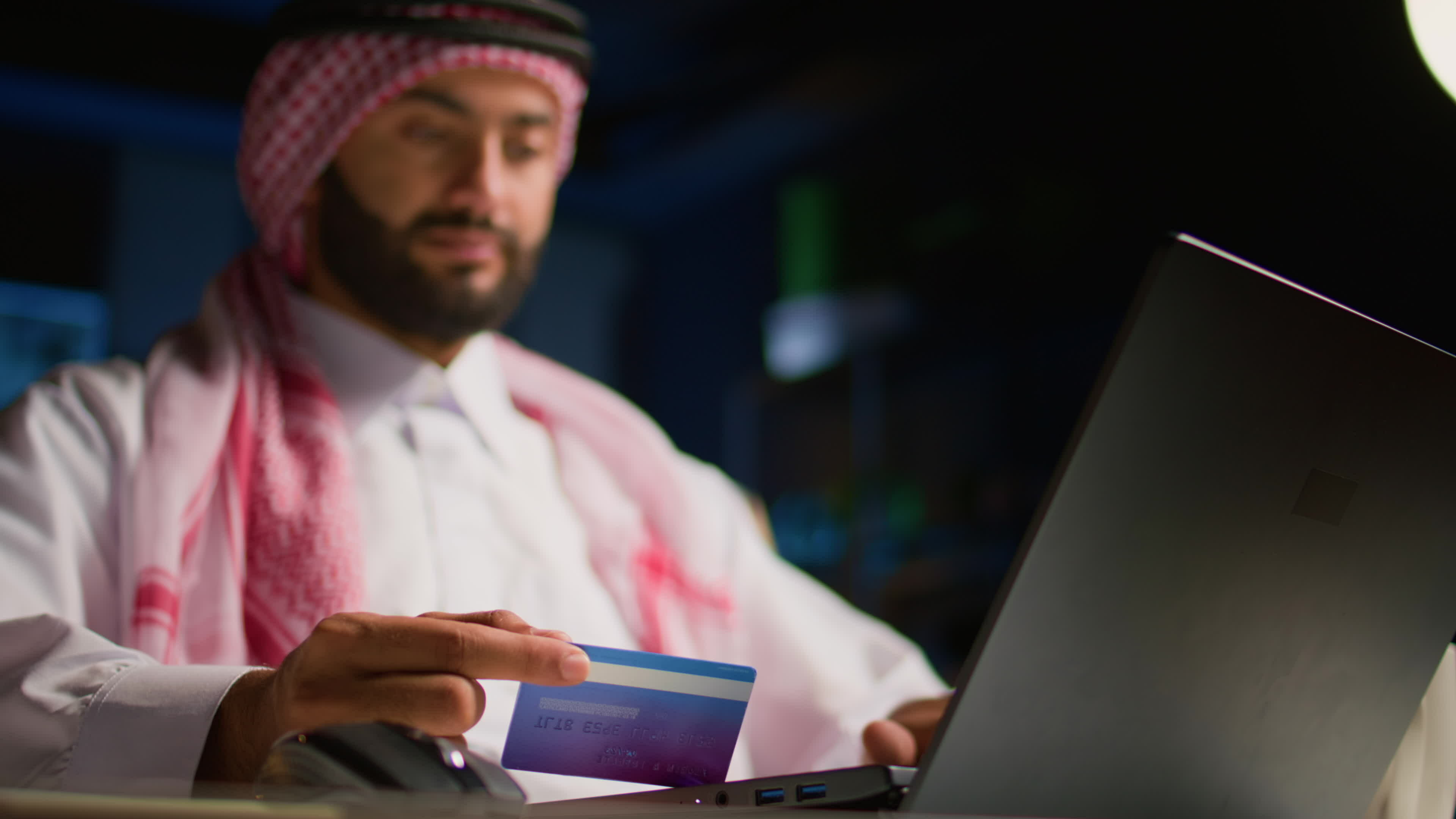 Cheerful Arab Man Doing Internet Shopping Typing Credit Card