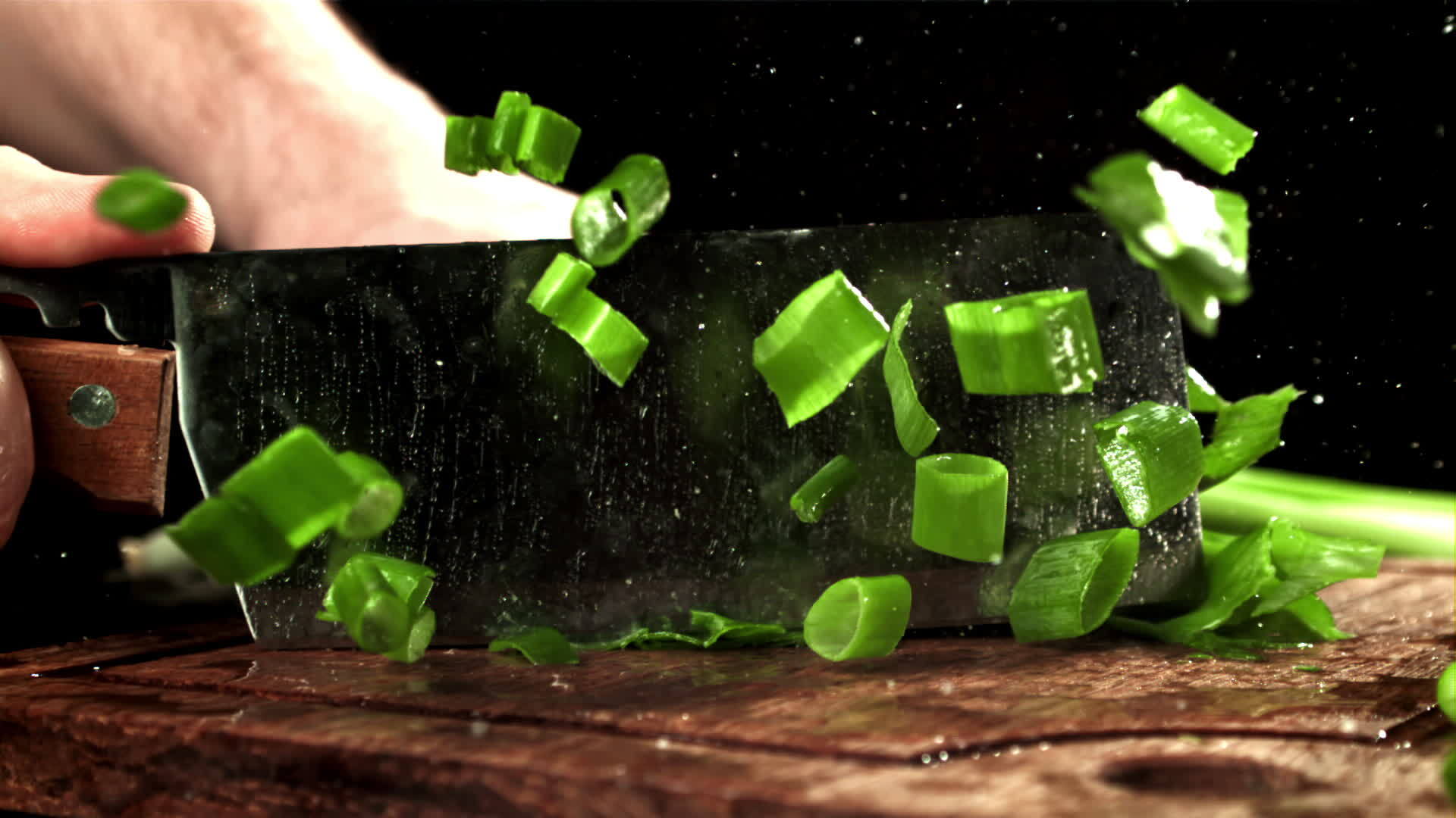 A Cook Chops Green Onions Filmed On A High Speed Camera At 1000 Fps