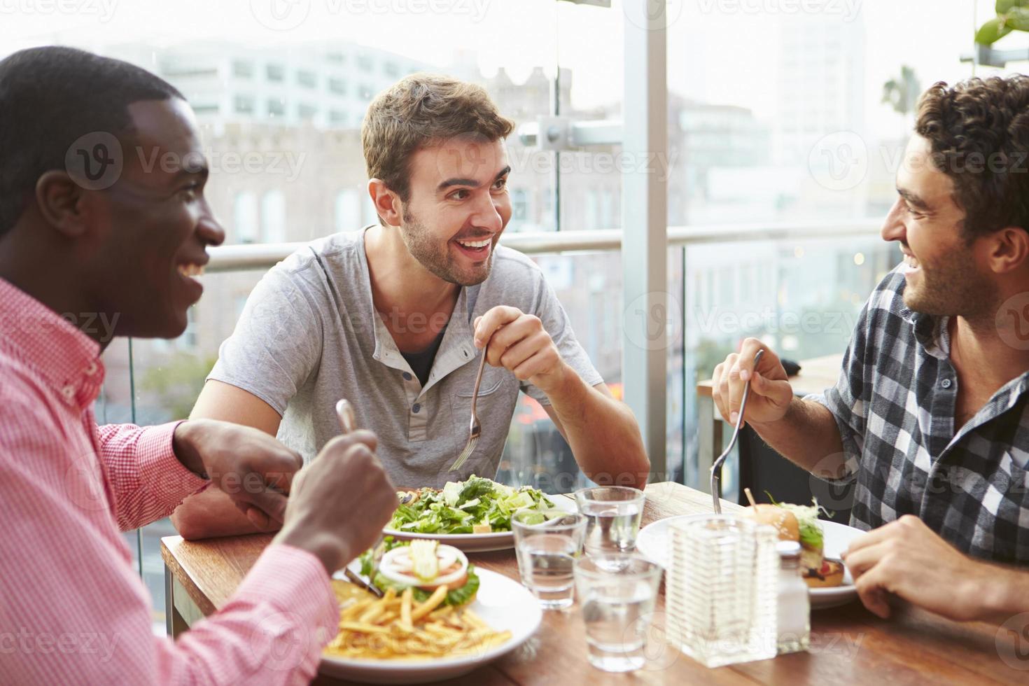 Three Male Friends Enjoying Lunch At Rooftop Restaurant 856239 Stock ... Three Male Friends Enjoying Lunch At Rooftop Restaurant 856239 Stock ...