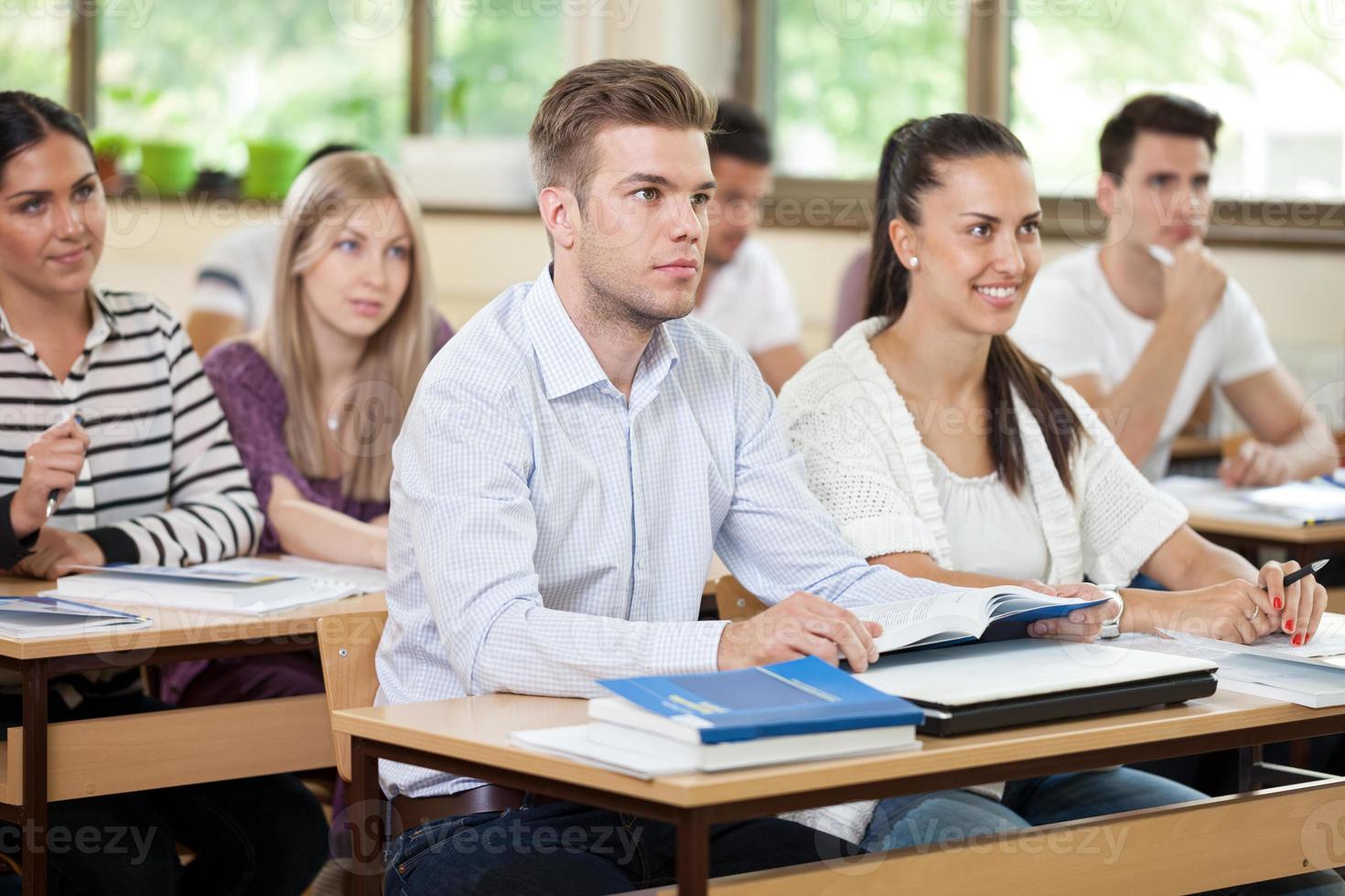 Male student listening a lecture in classroom 858522 Stock Photo at ...