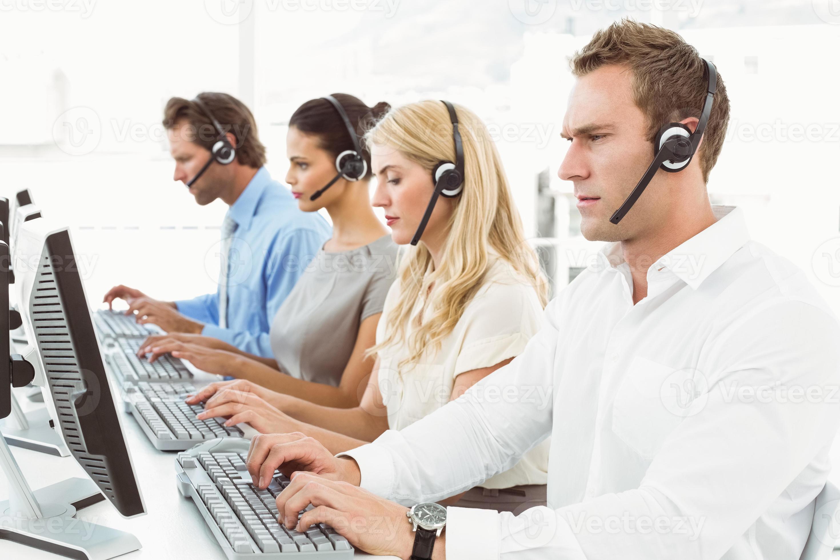 Business people with headsets using computers in office 865428 Stock ... Business people with headsets using computers in office 865428 Stock ...