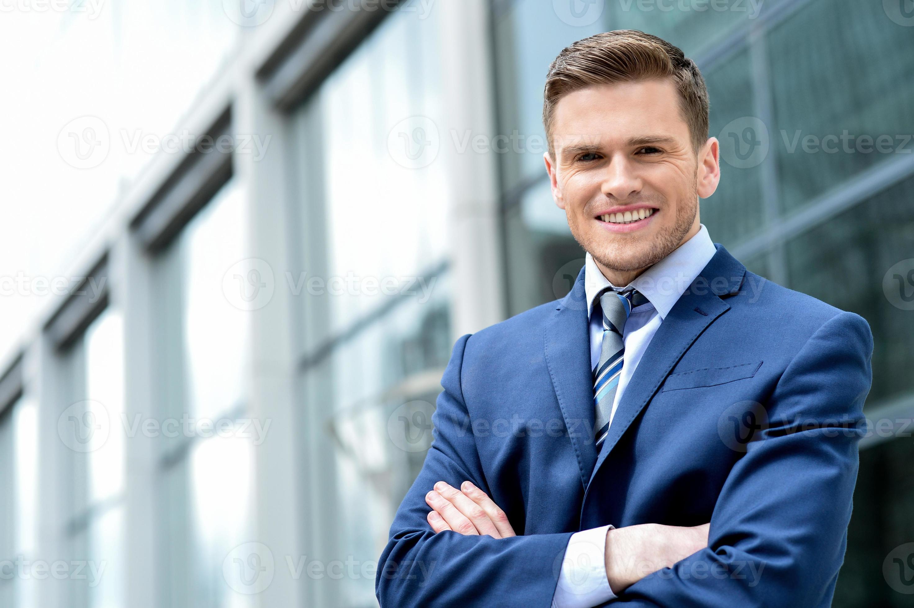 Young businessman smiling in a office outdoor 1027183 Stock Photo at ... Young businessman smiling in a office outdoor 1027183 Stock Photo at ...