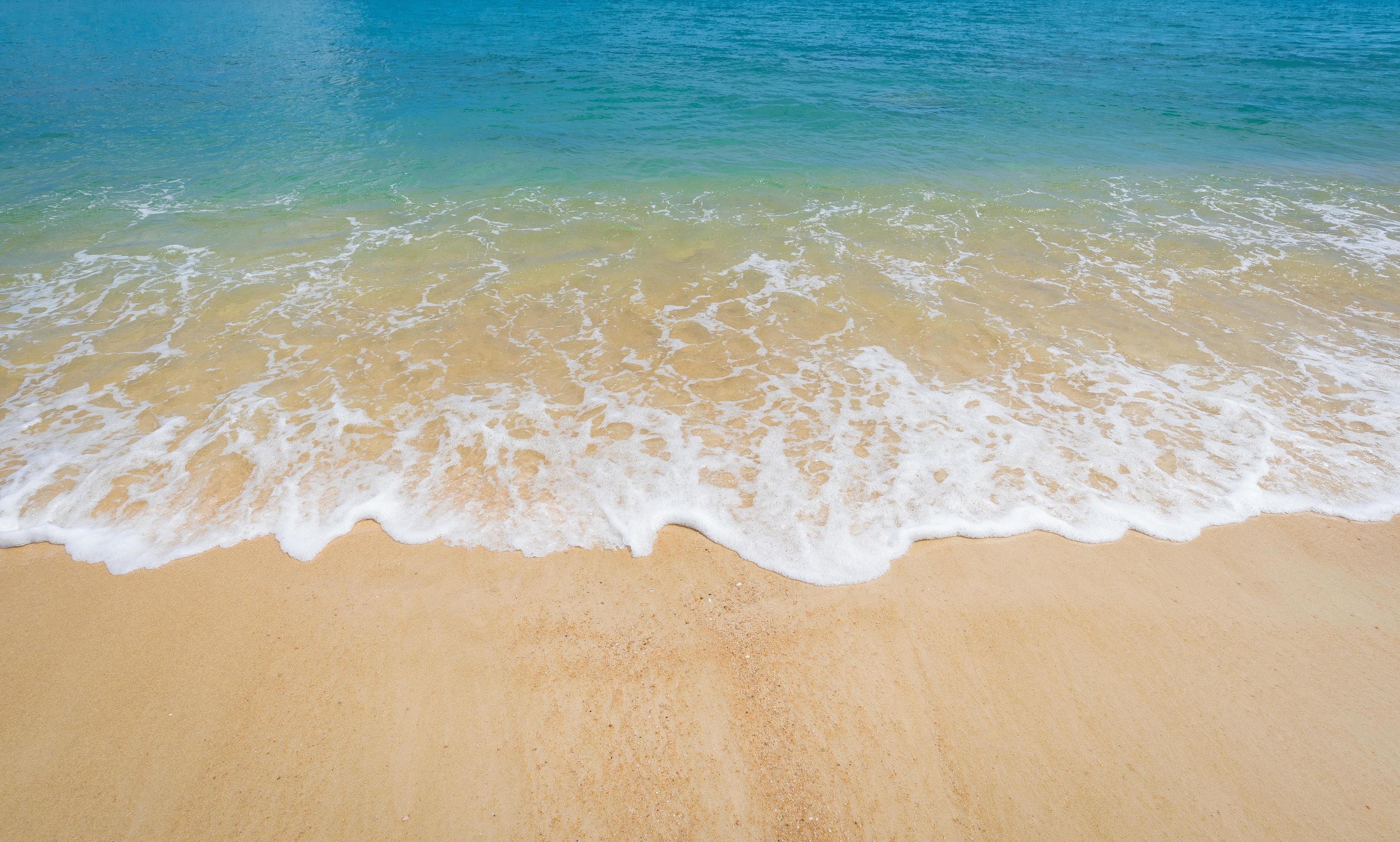 Waves washing up on beach 1227560 Stock Photo at Vecteezy