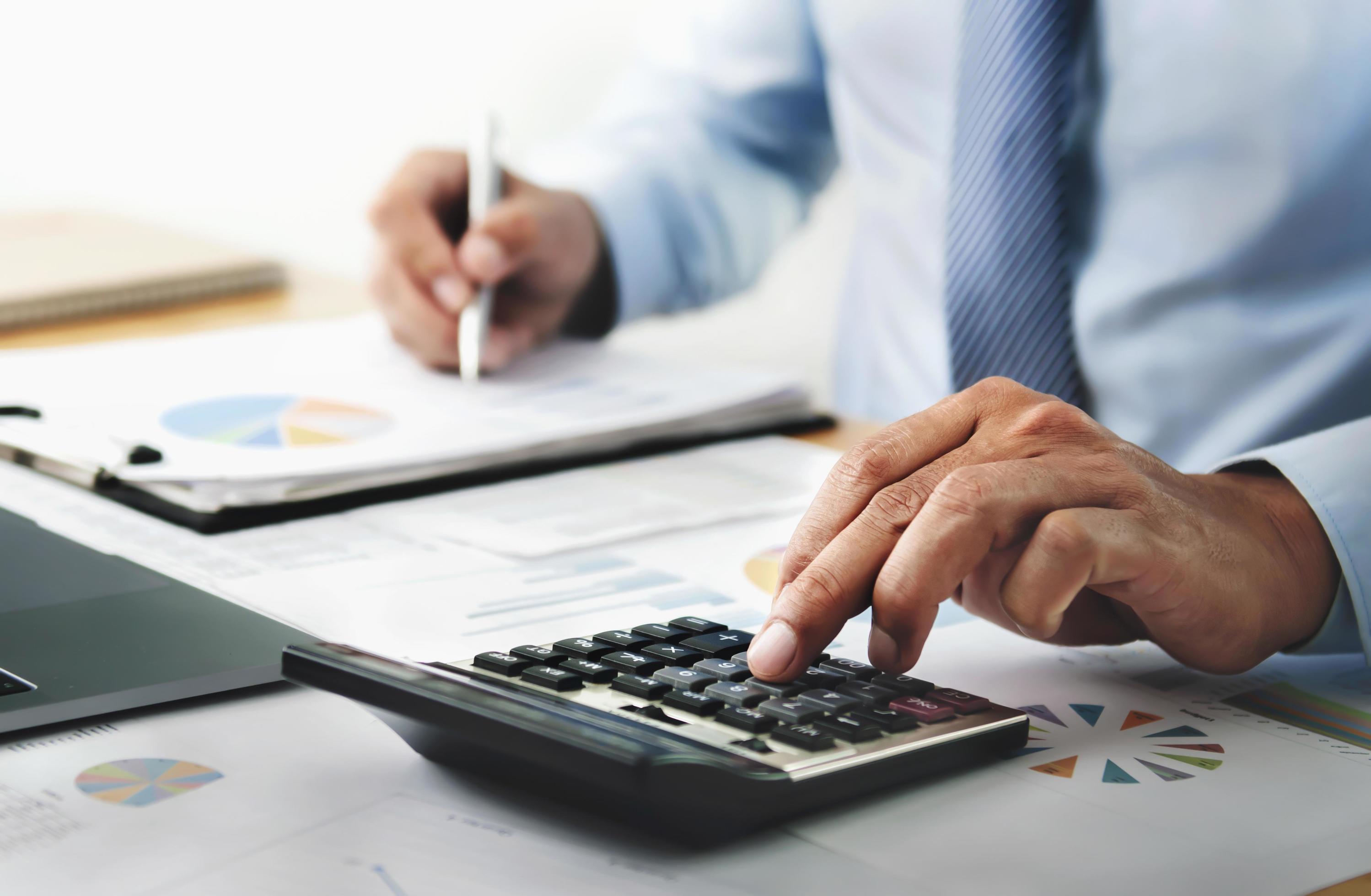 Business person using calculator 1309749 Stock Photo at Vecteezy Business person using calculator 1309749 Stock Photo at Vecteezy