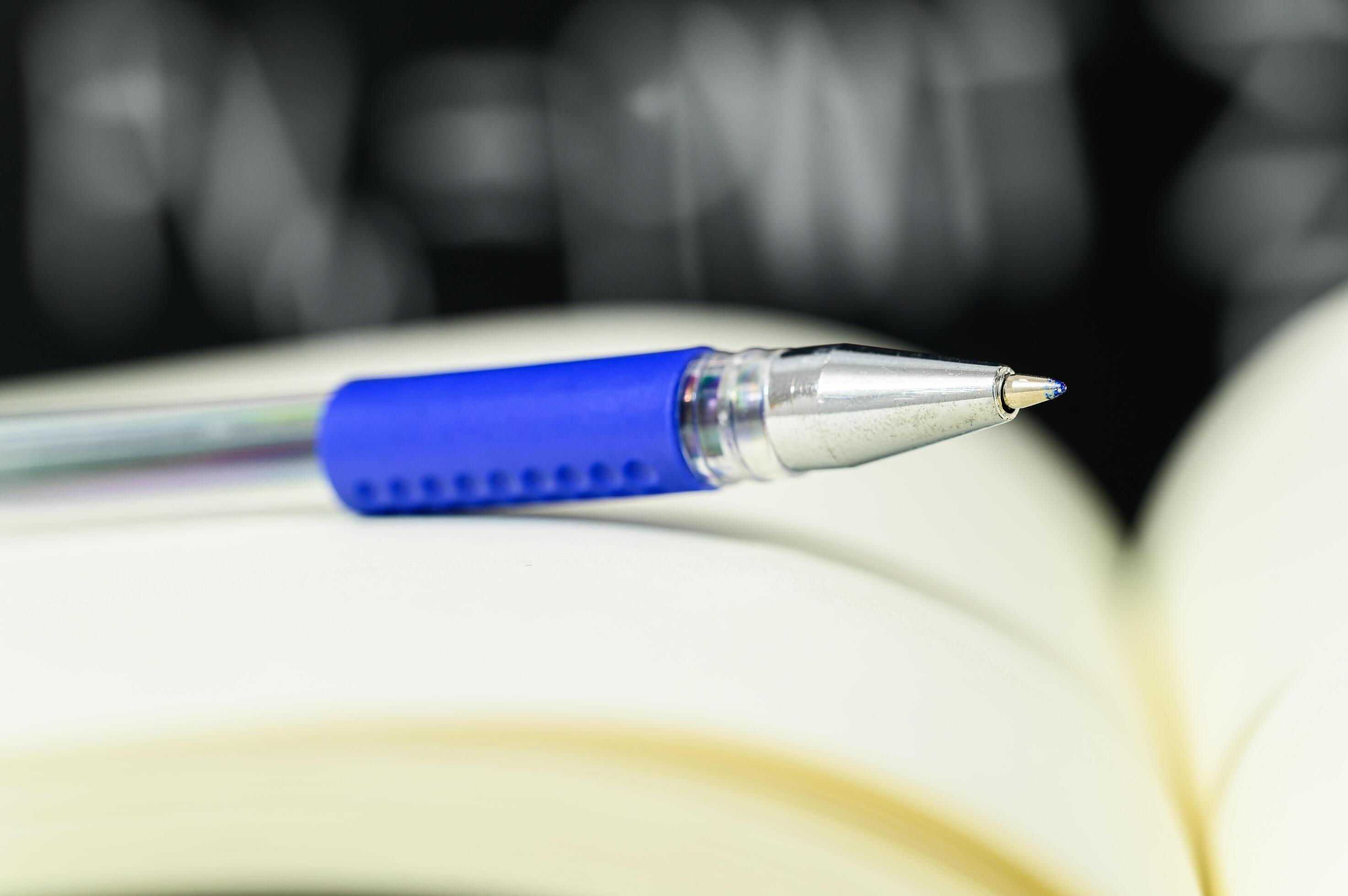 A pen on a book 2009181 Stock Photo at Vecteezy