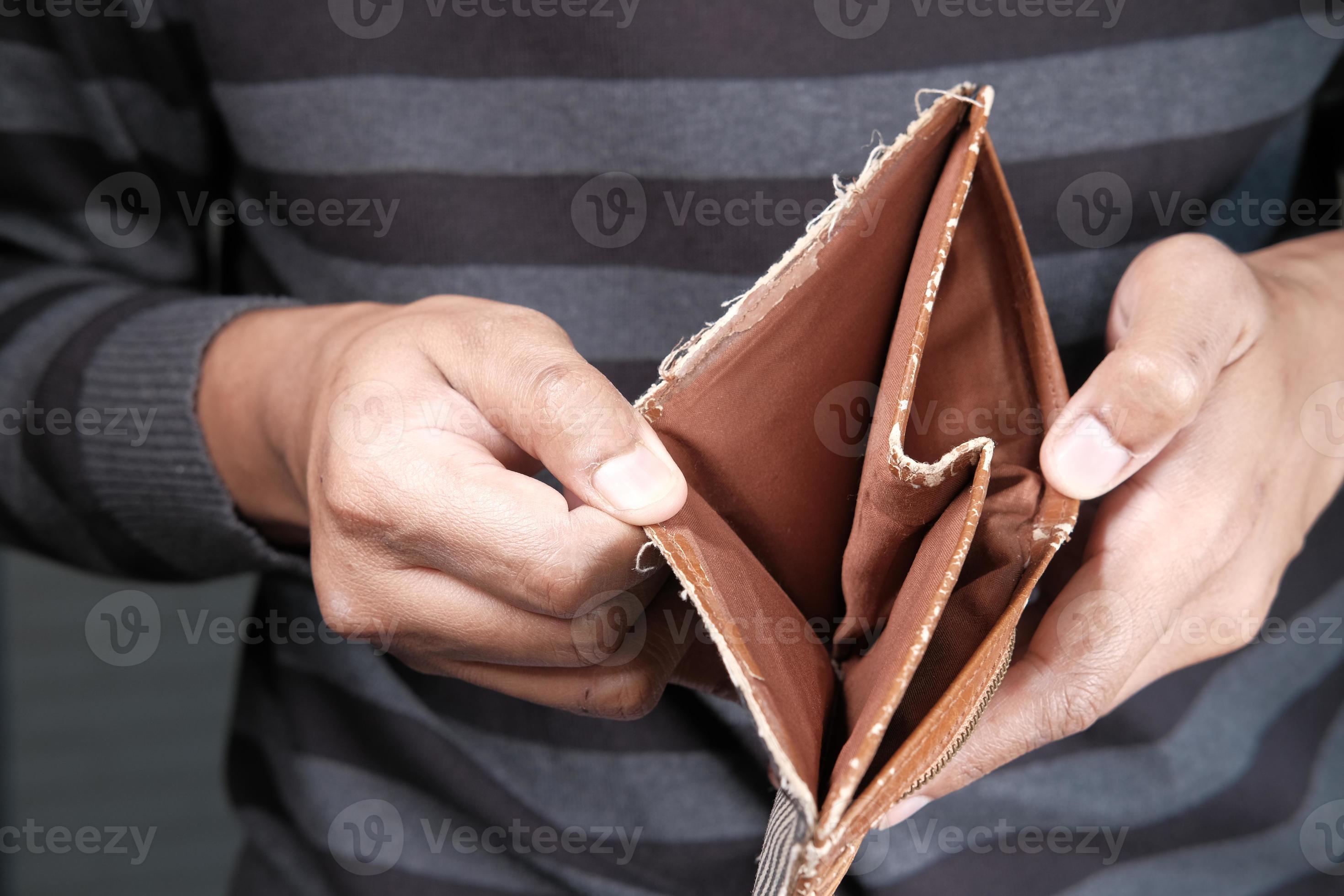 Man holding an empty wallet 2073361 Stock Photo at Vecteezy Man holding an empty wallet 2073361 Stock Photo at Vecteezy