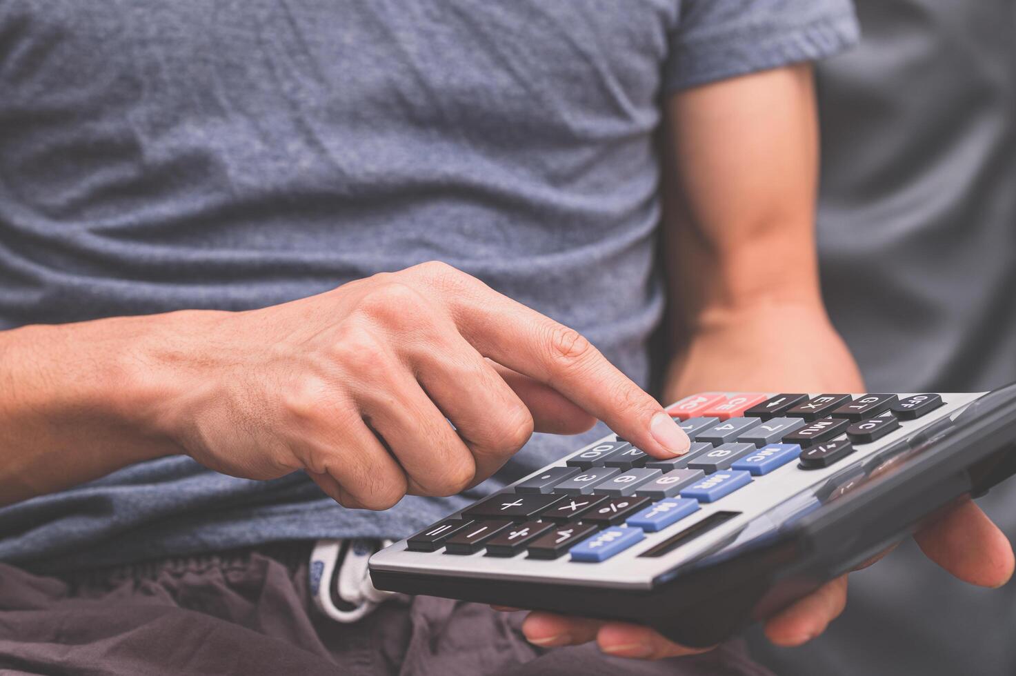 A Human Using A Calculator 2081294 Stock Photo At Vecteezy a-human-using-a-calculator-2081294-stock-photo-at-vecteezy