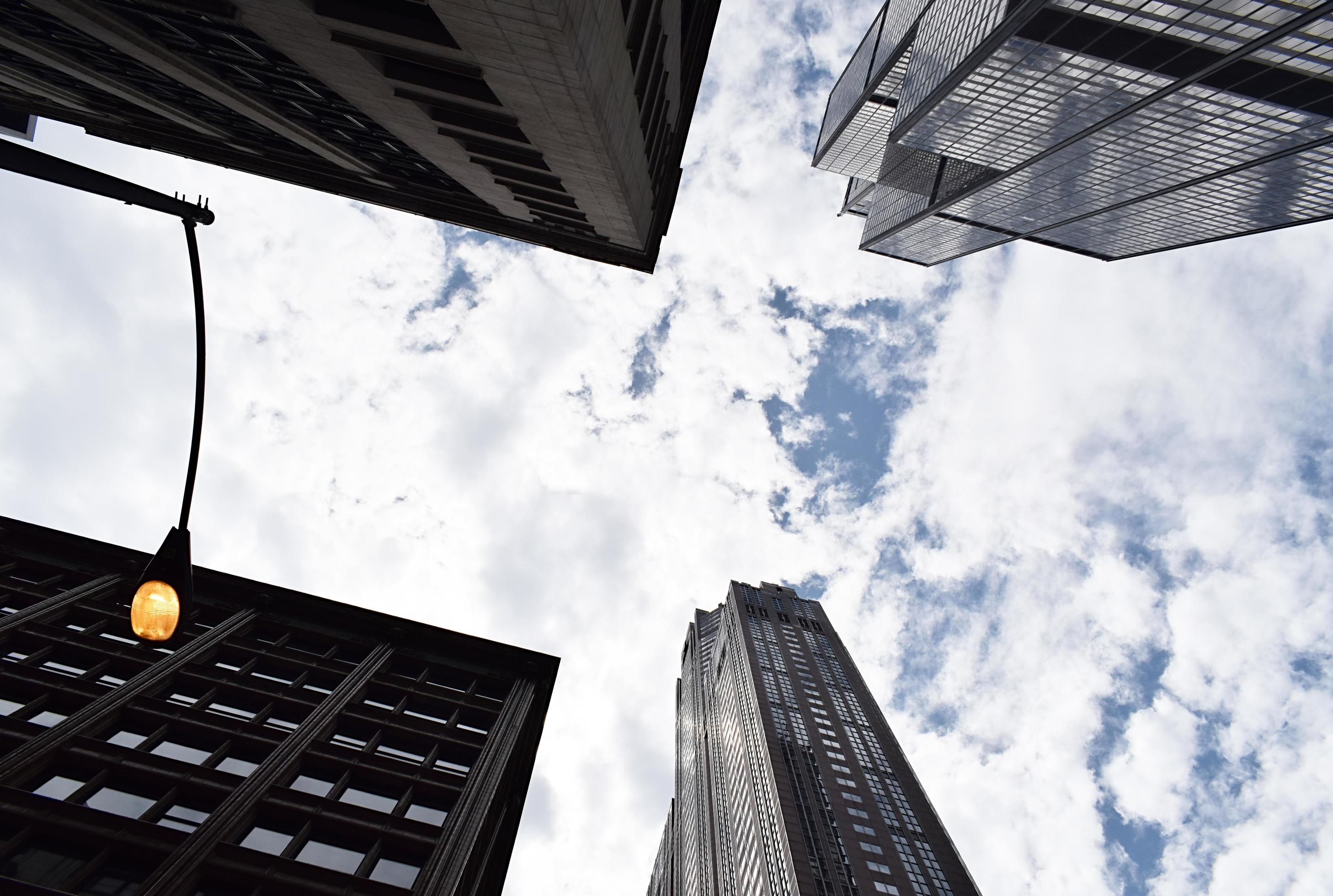 High rise buildings under a blue and white sunny cloudy sky 2223990 ...
