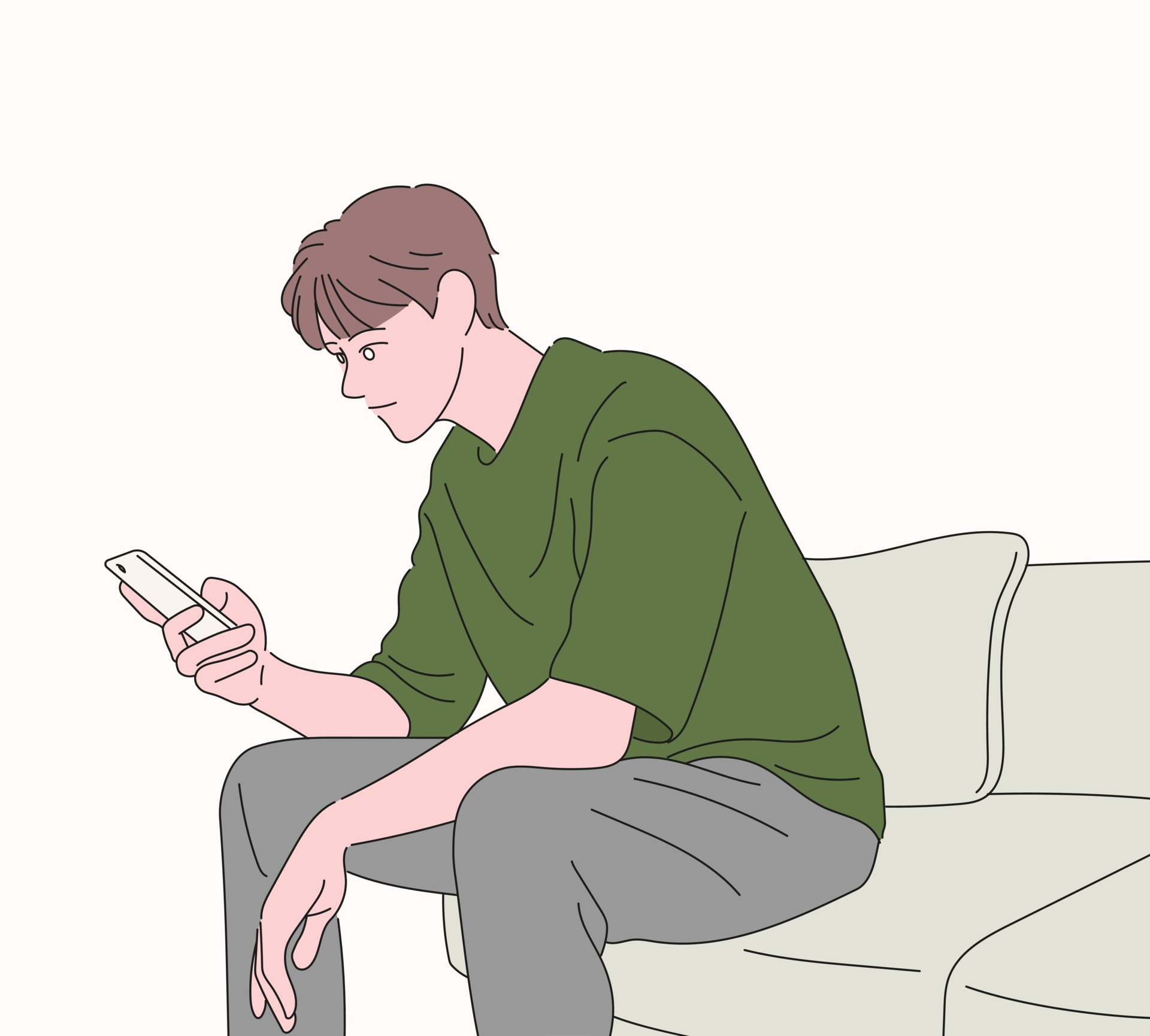 un hombre está sentado en un sofá y mira un teléfono celular ... un hombre está sentado en un sofá y mira un teléfono celular ...