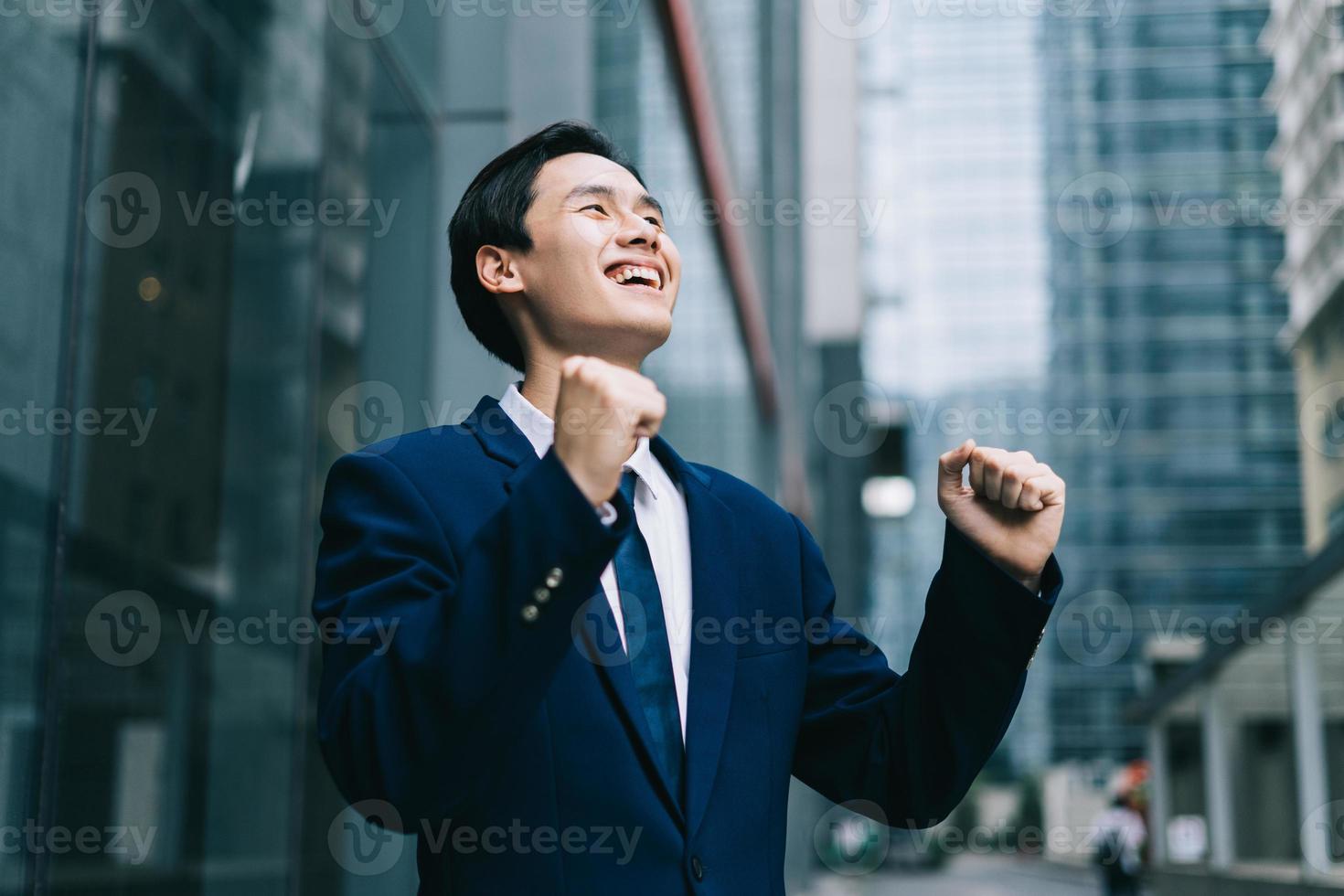 Young Asian businessman with modern building background 2892954 Stock ...