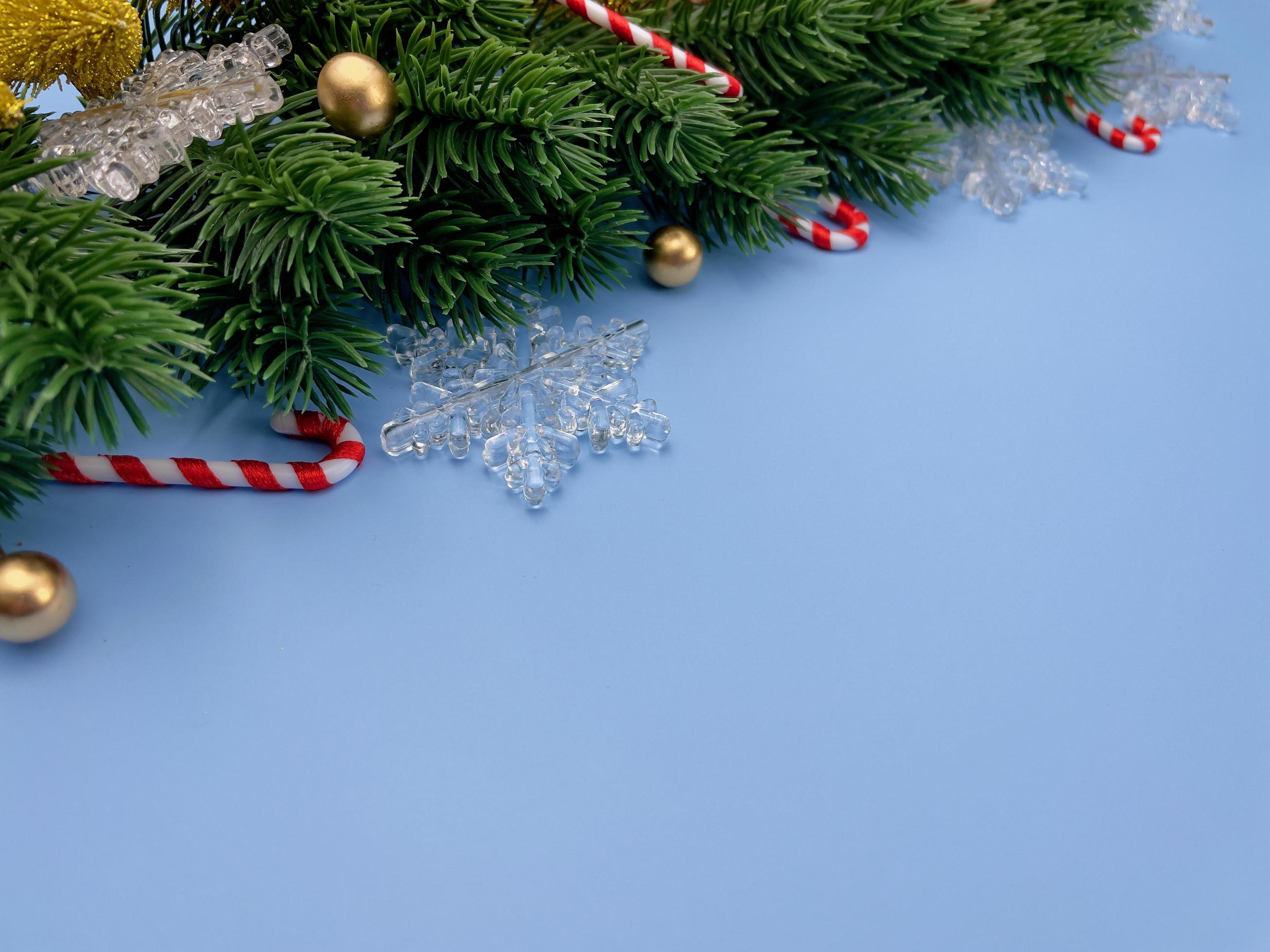 Christmas Decorations Pine Tree Leaves Golden Balls Snowflakes Golden Berries On Blue