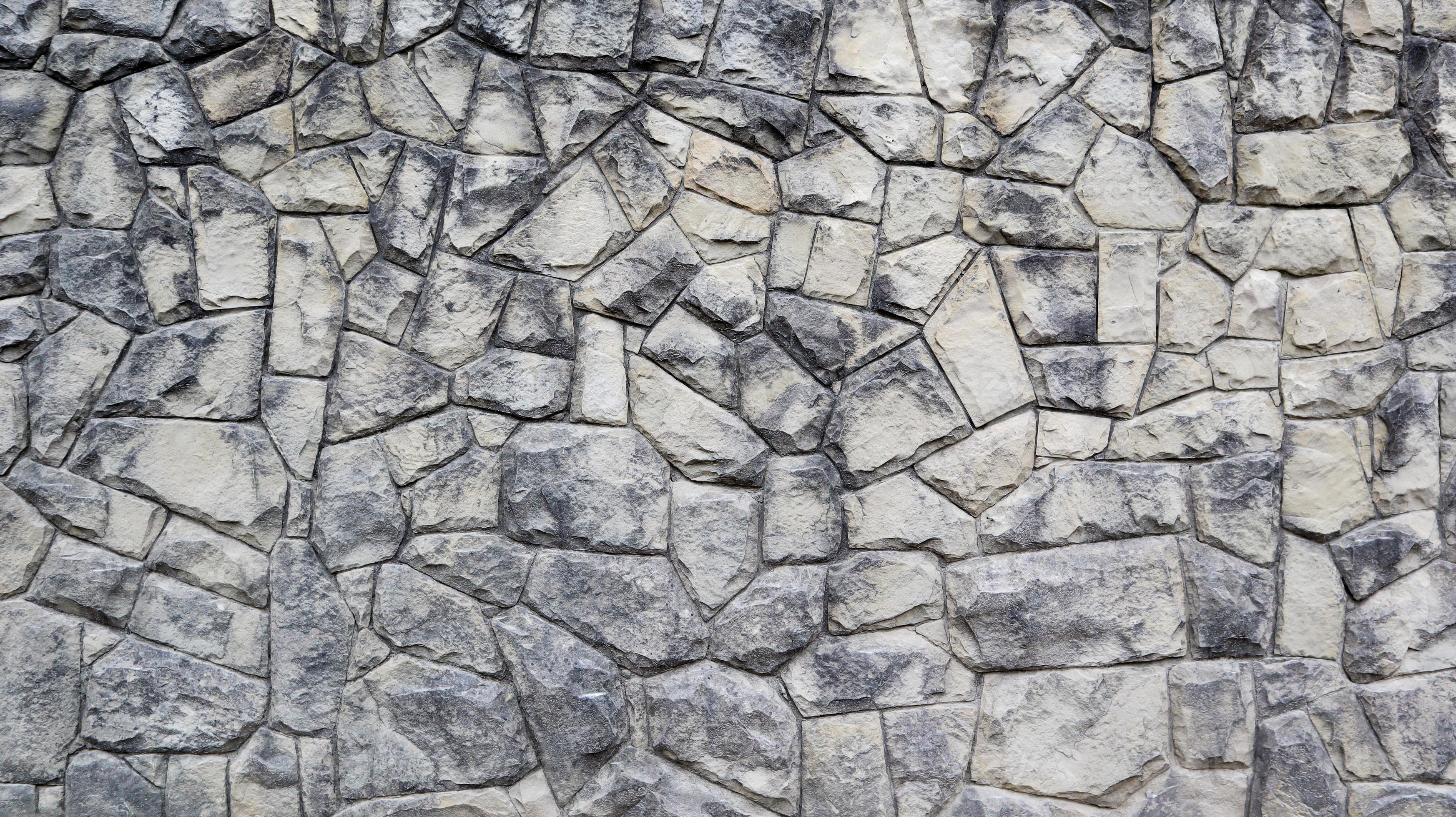 The texture of the stone wall. Old castle stone wall texture background. Stone wall as a ...