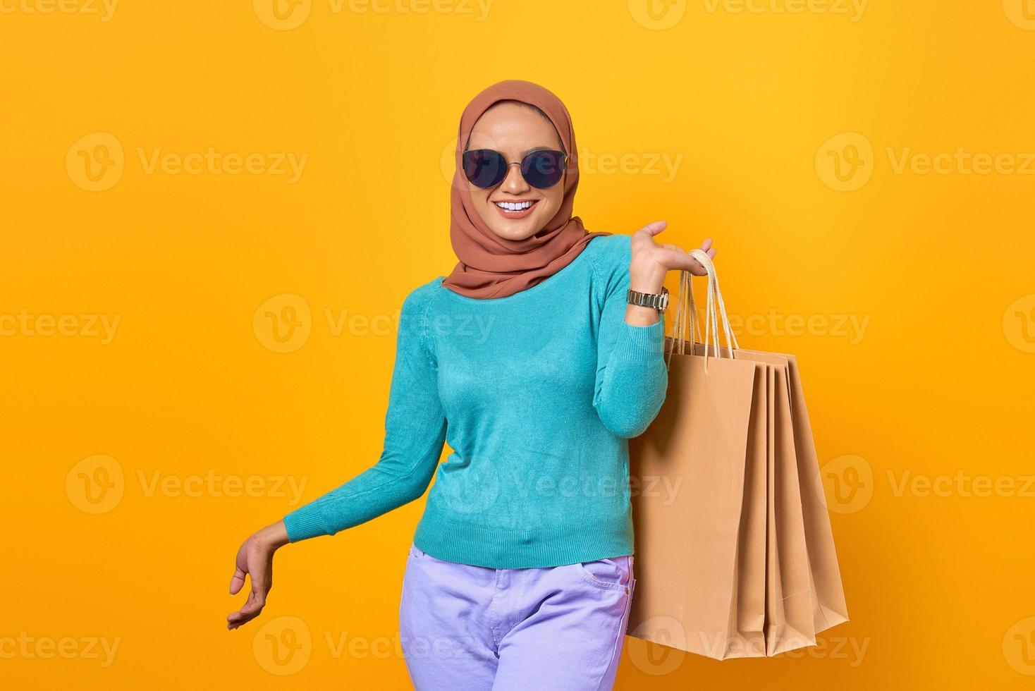 Beautiful Young Asian Woman Holding Shopping Bags With A Happy