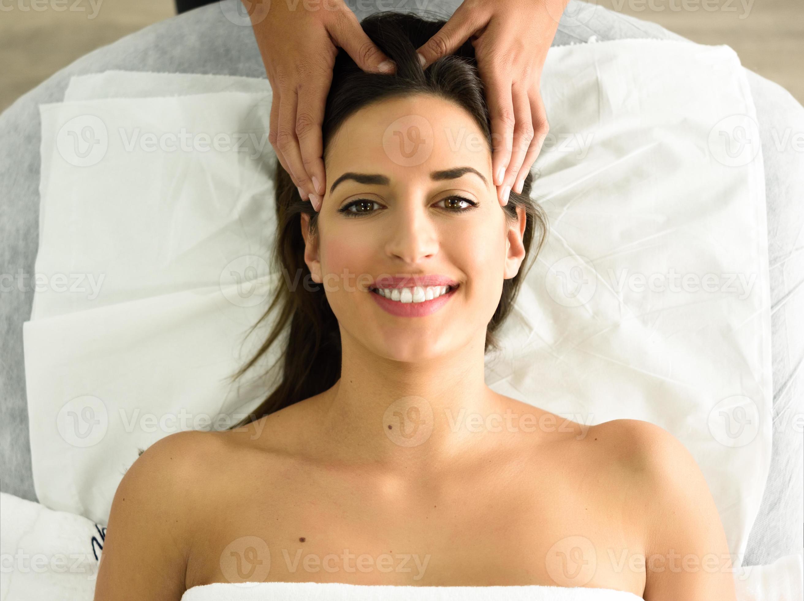 Young Smiling Woman Receiving A Head Massage In A Spa Center 4676451