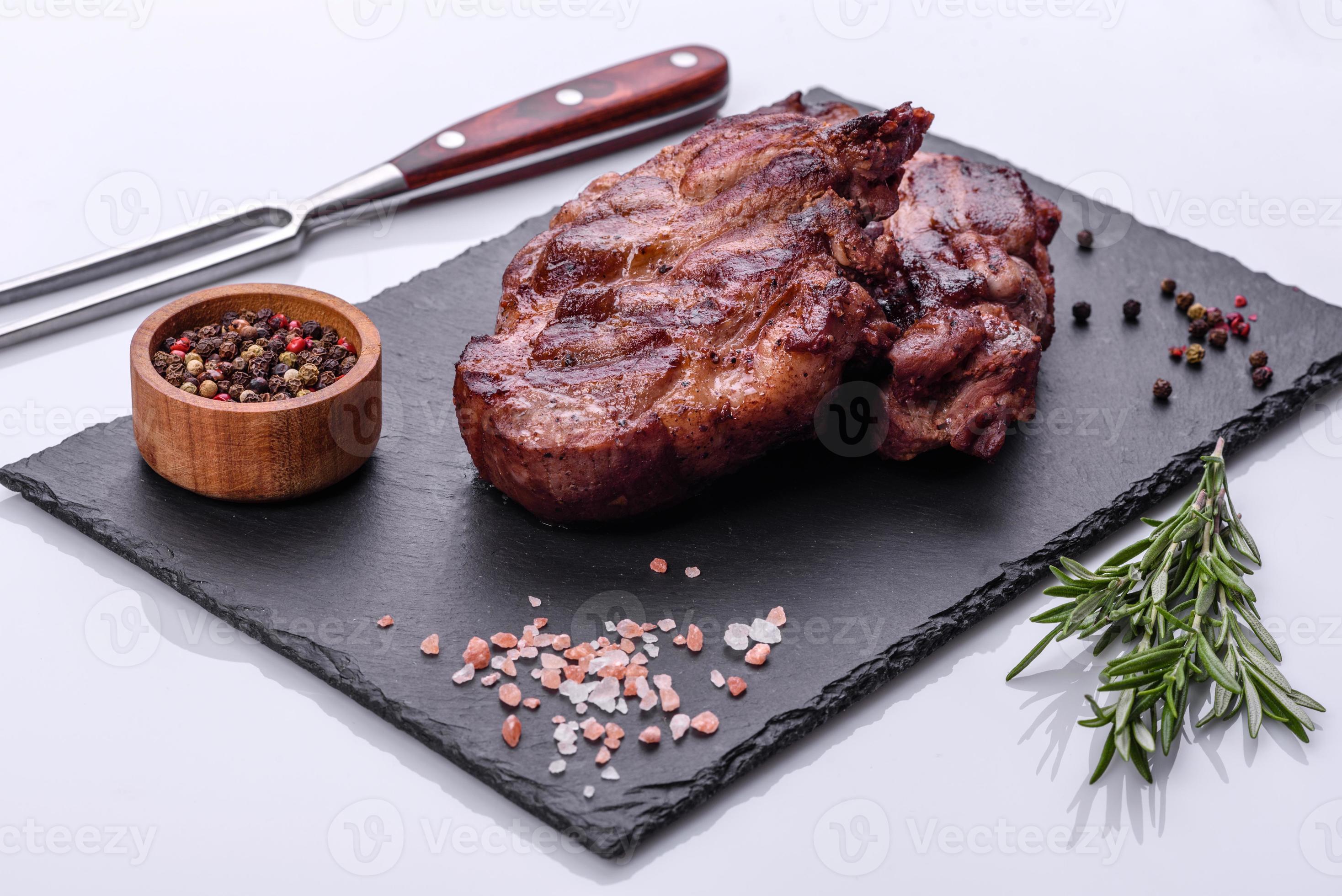 grilled beef steaks with spices on a dark cutting board 4768171 Stock ...