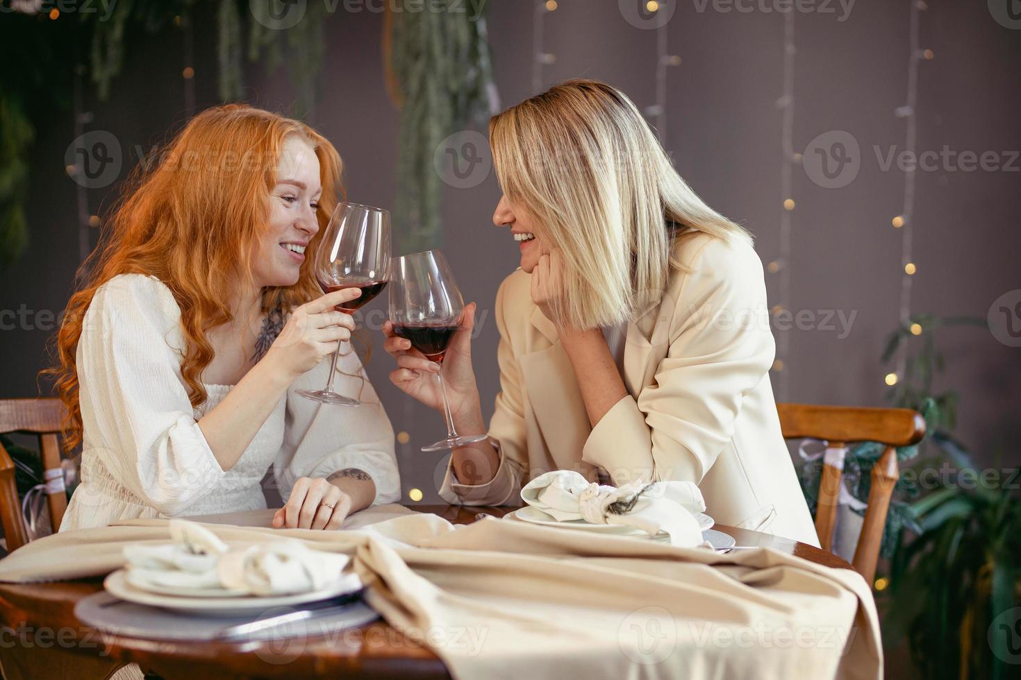 Lesbian Couple Having Dinner In A Restaurant Girls Drink Wine And Talk