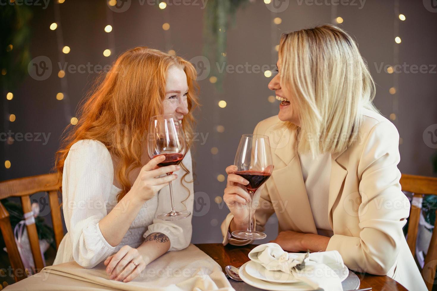 Lesbian Couple Having Dinner In A Restaurant Girls Drink Wine And Talk