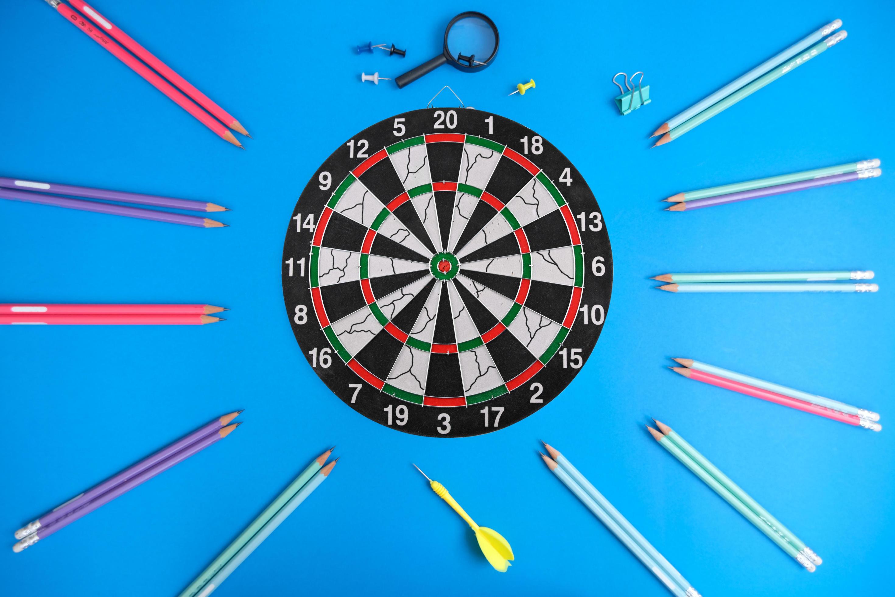 Dart board and a desk. Workspace with a target and a successful ...