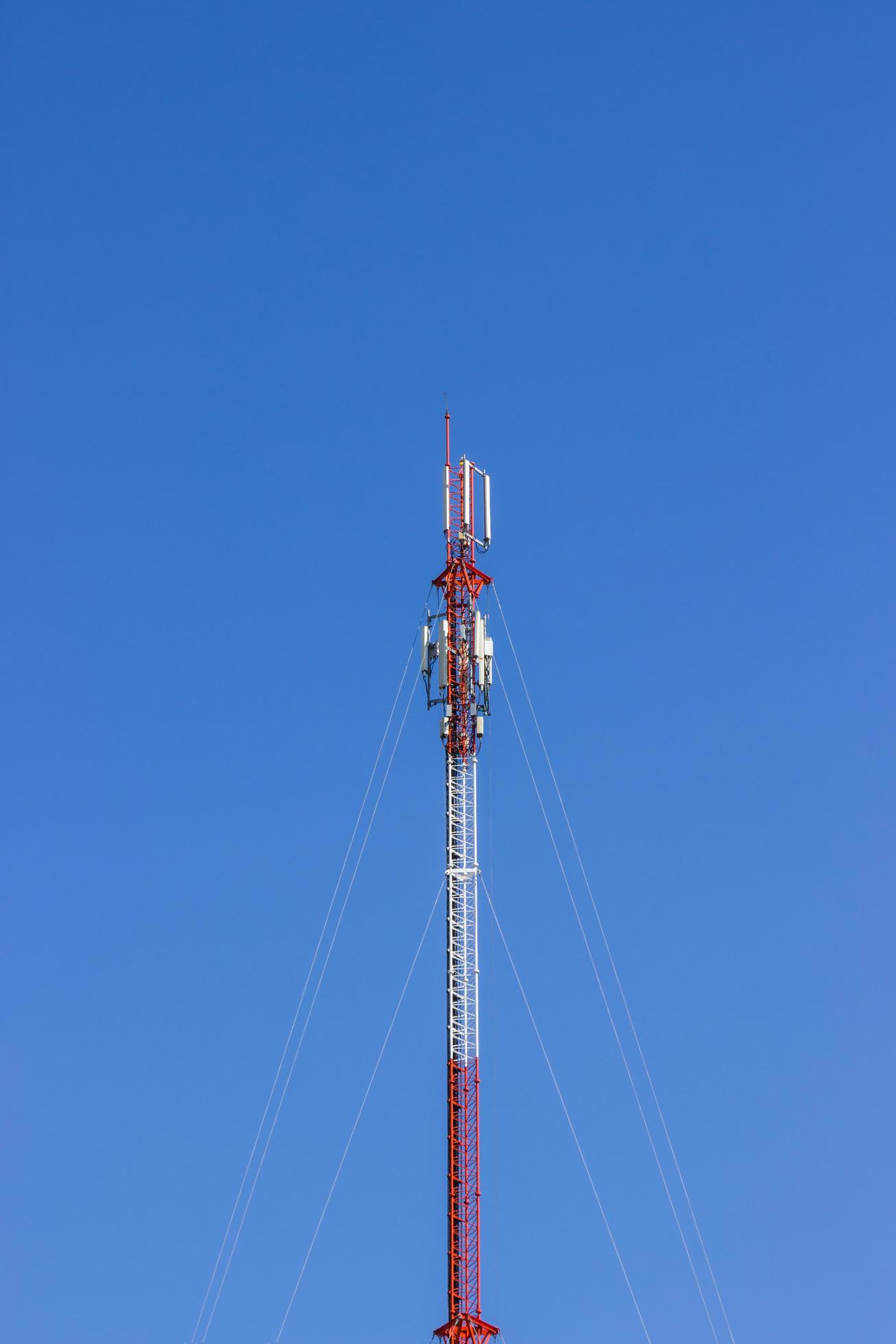 Red and white Telecommunication tower in a day of clear blue sky. Telephone pole 5024813 Stock ...