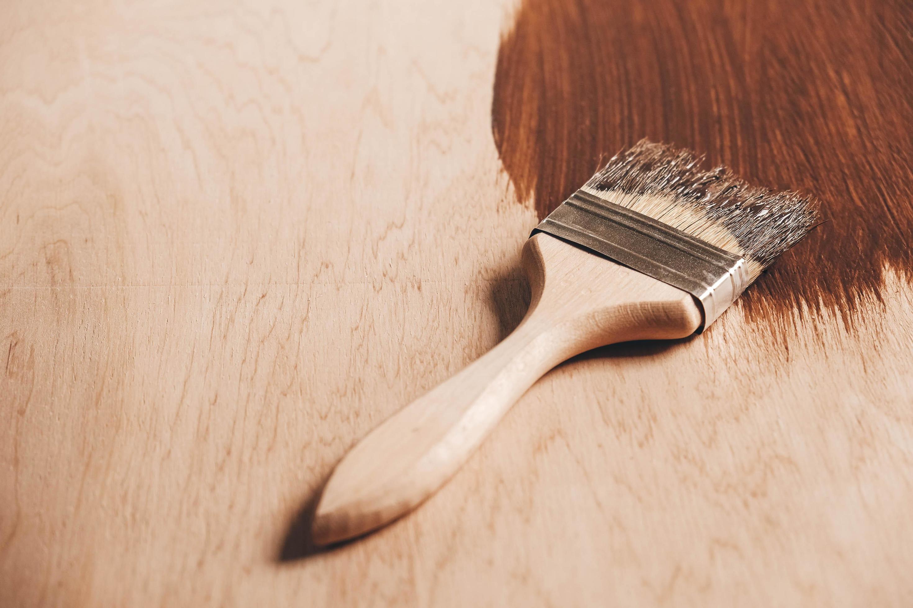 Paint brush with wooden handle and natural bristles against background ...
