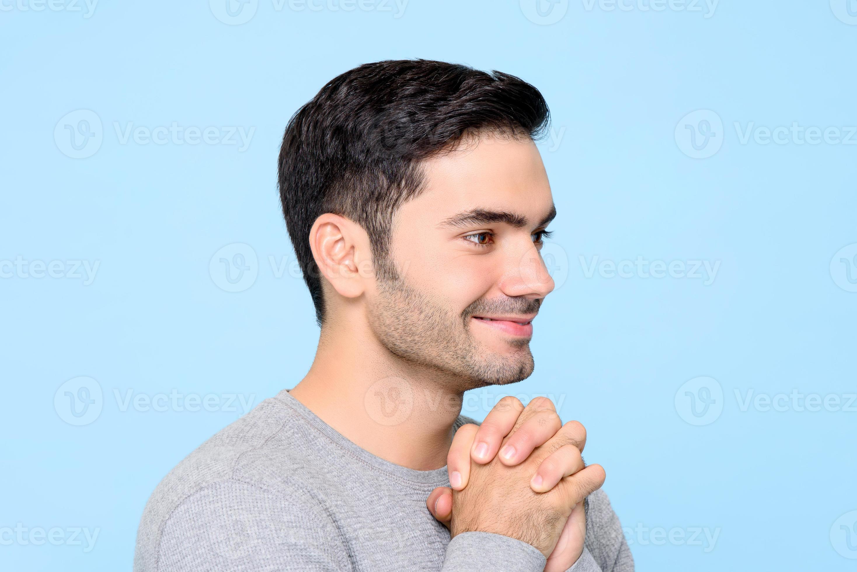 Side View Portrait Of A Smiling Handsome Caucasian Man Holding His