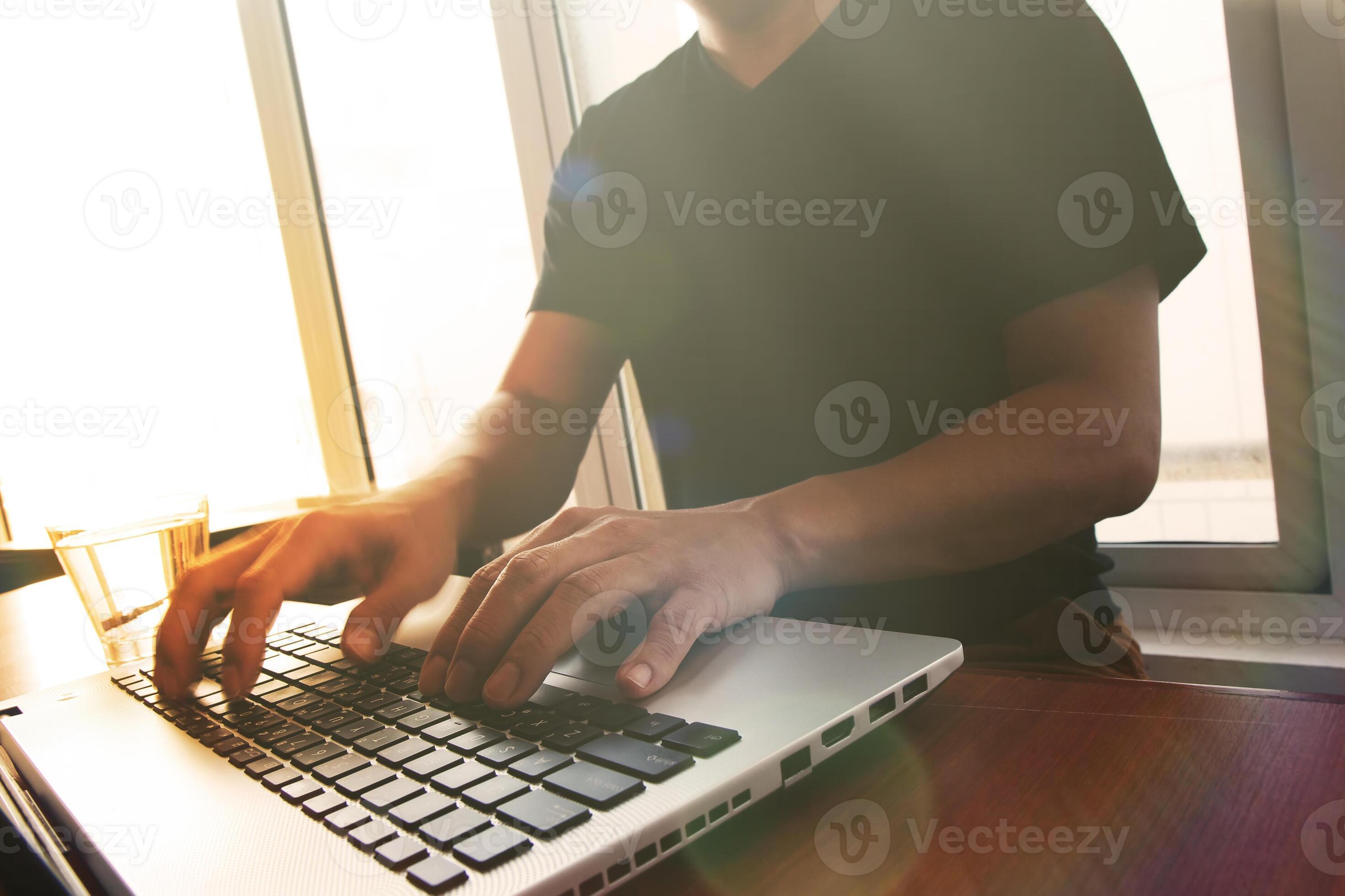 Young creative designer man working at office with computer laptop as ... Young creative designer man working at office with computer laptop as ...