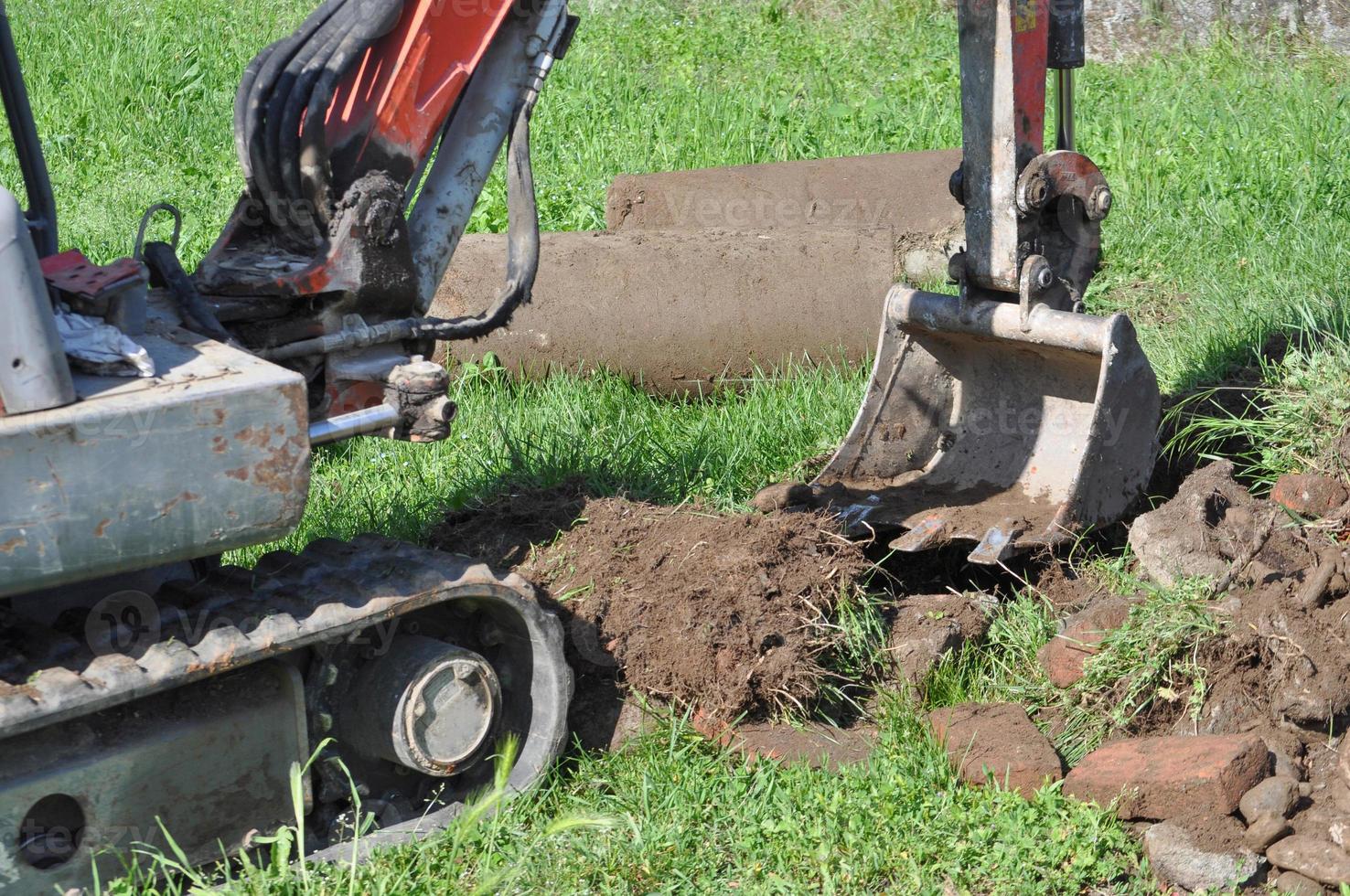 Excavator digging a hole 5309659 Stock Photo at Vecteezy