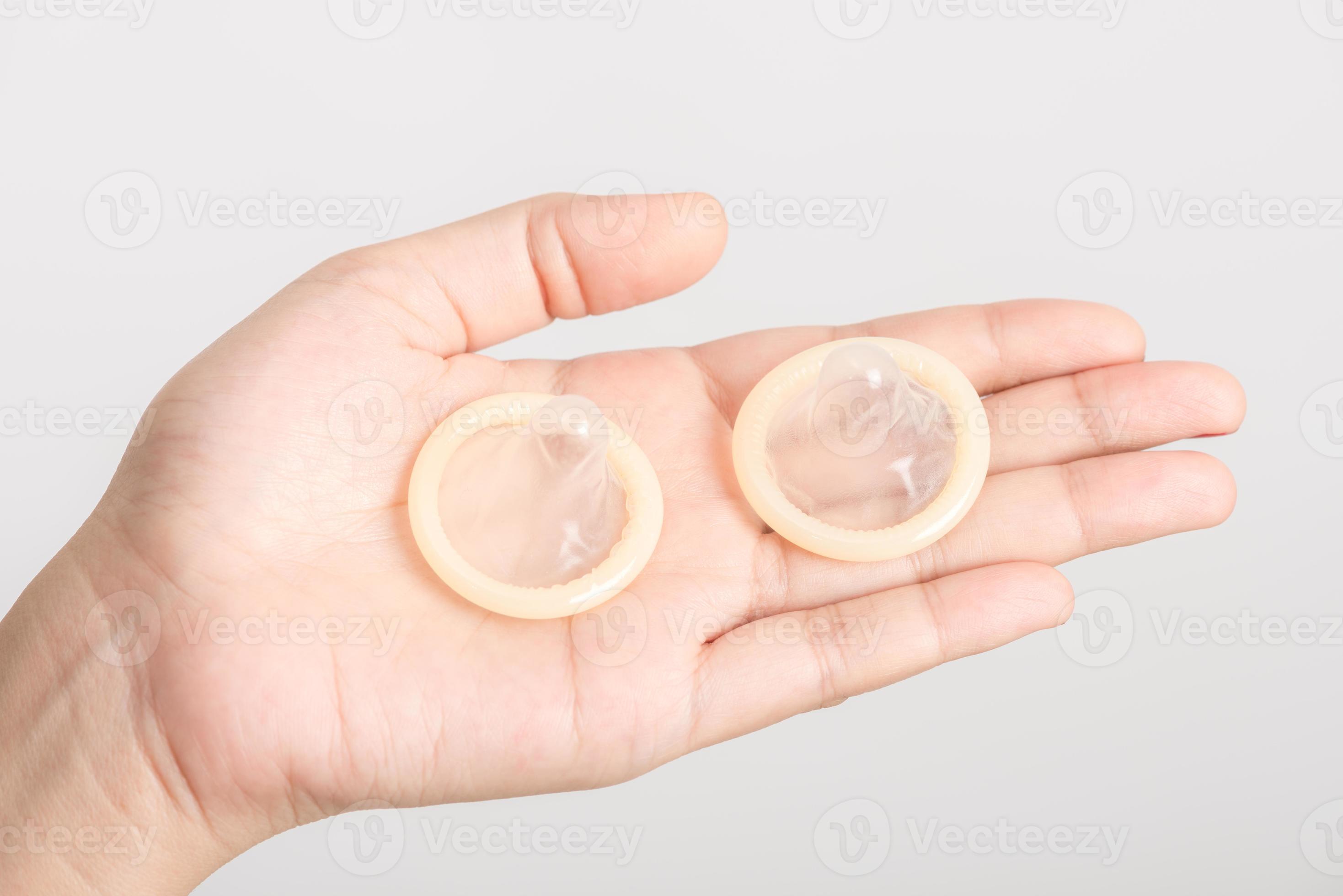 Asian Woman Hand Holding Condoms On White Background 5357285 Stock