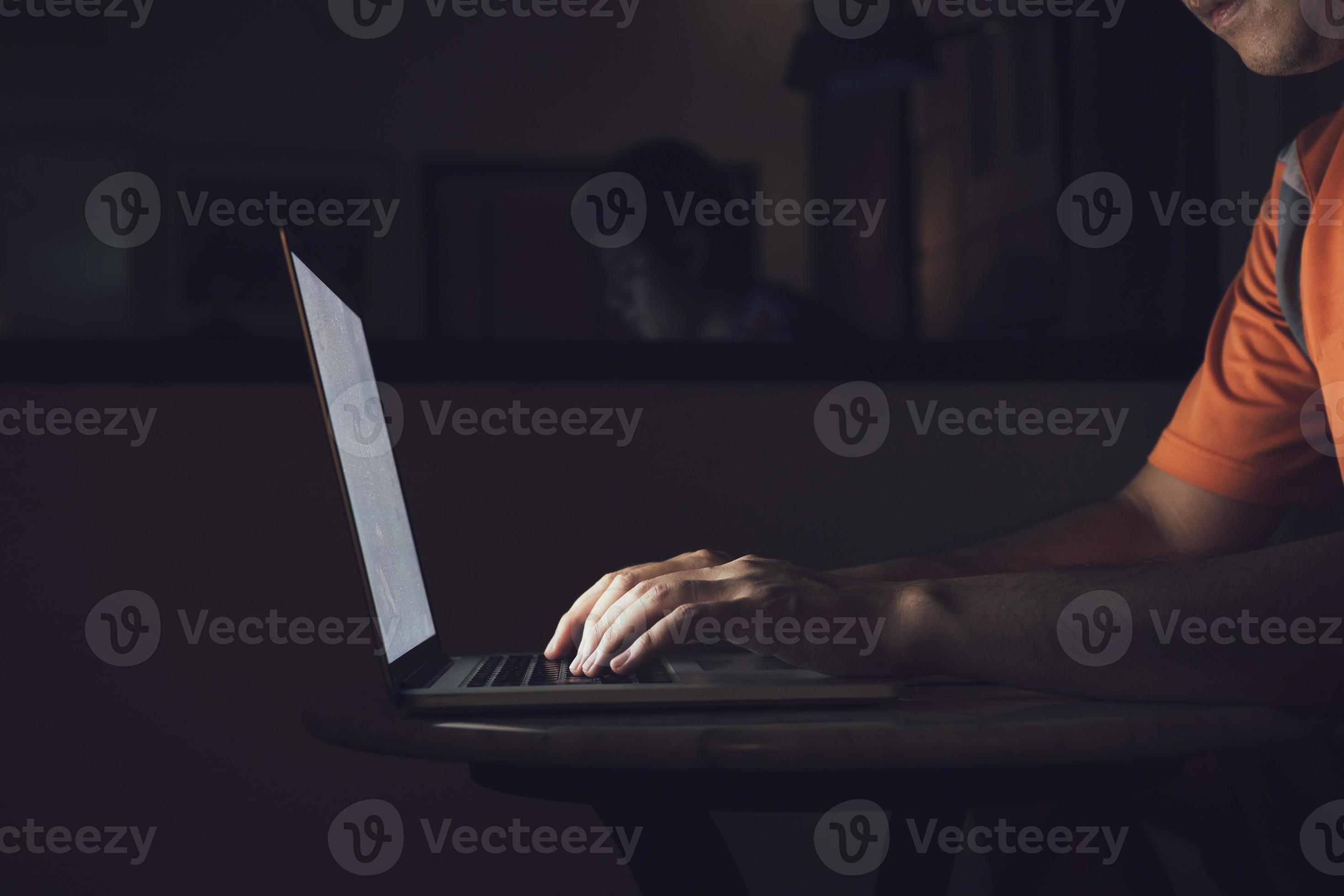 Man typing on keyboard and working at computer laptop in night. 5409395 ...