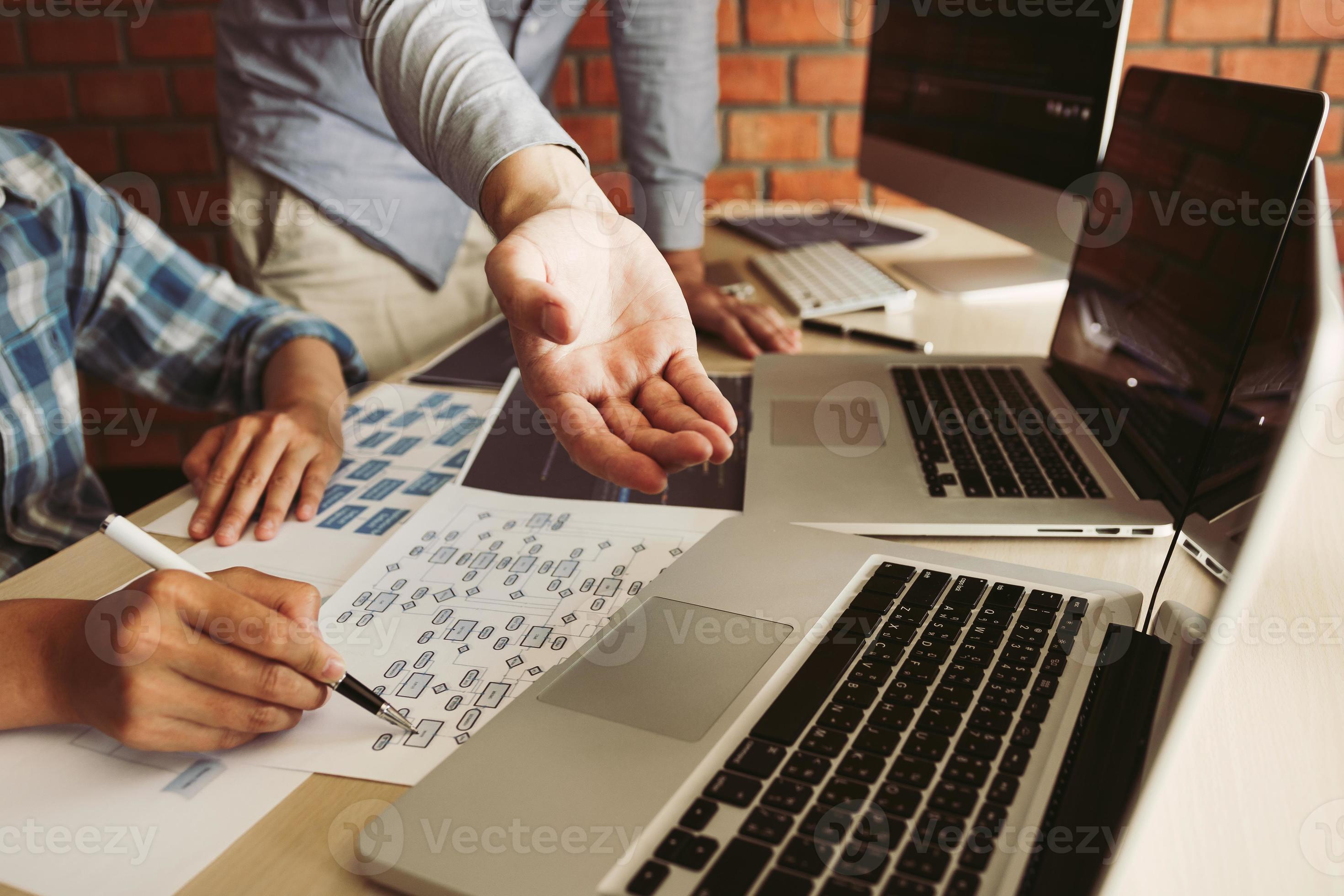 Two software developers are analyzing together about the code written ...