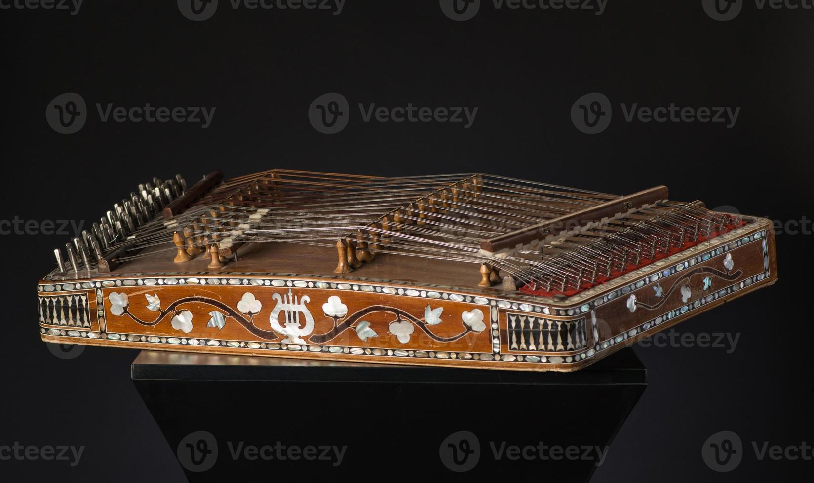 ancient Asian stringed musical instrument on black background with ...