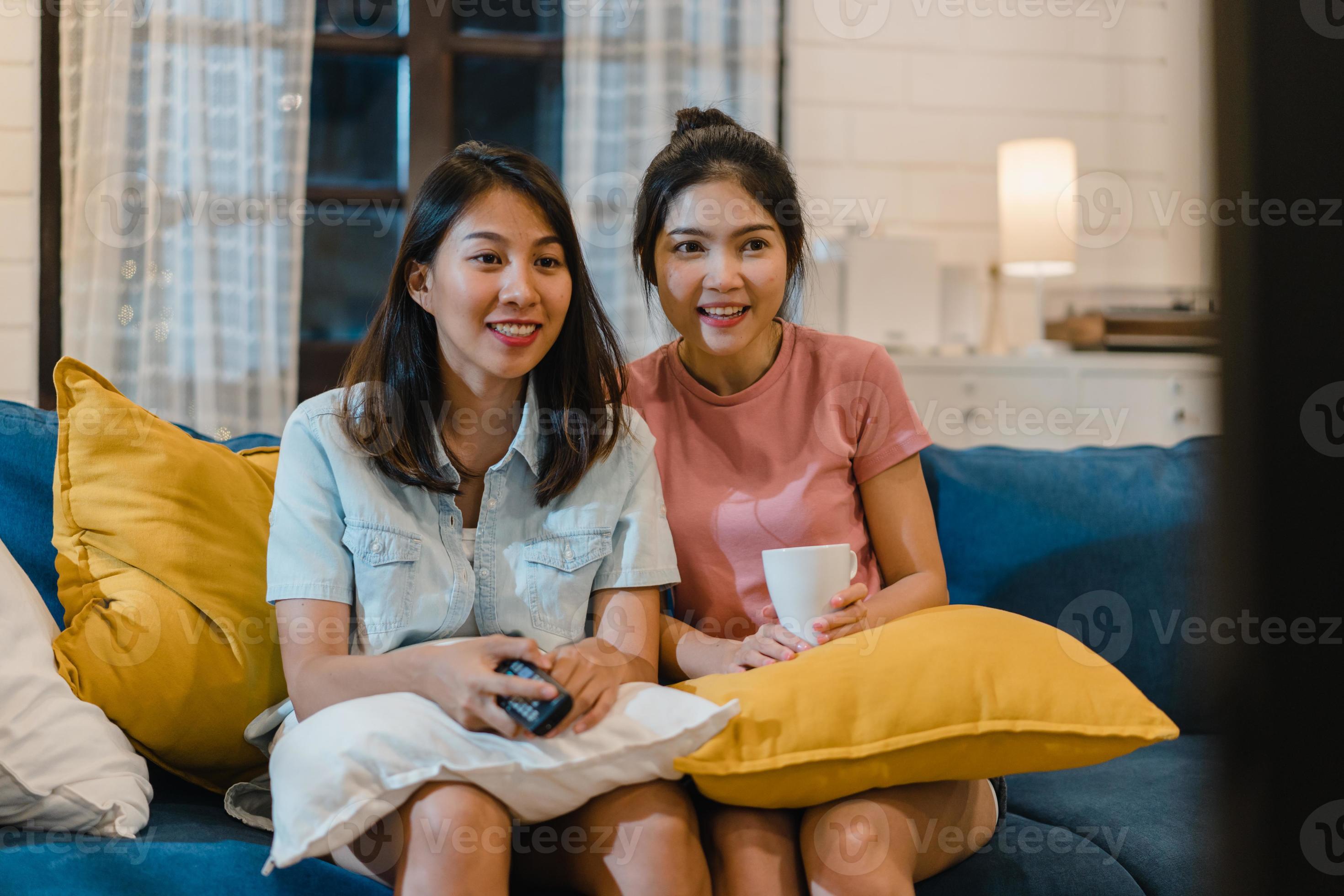 Lesbian Lgbt Women Couple Watching Television At Home Asian Female