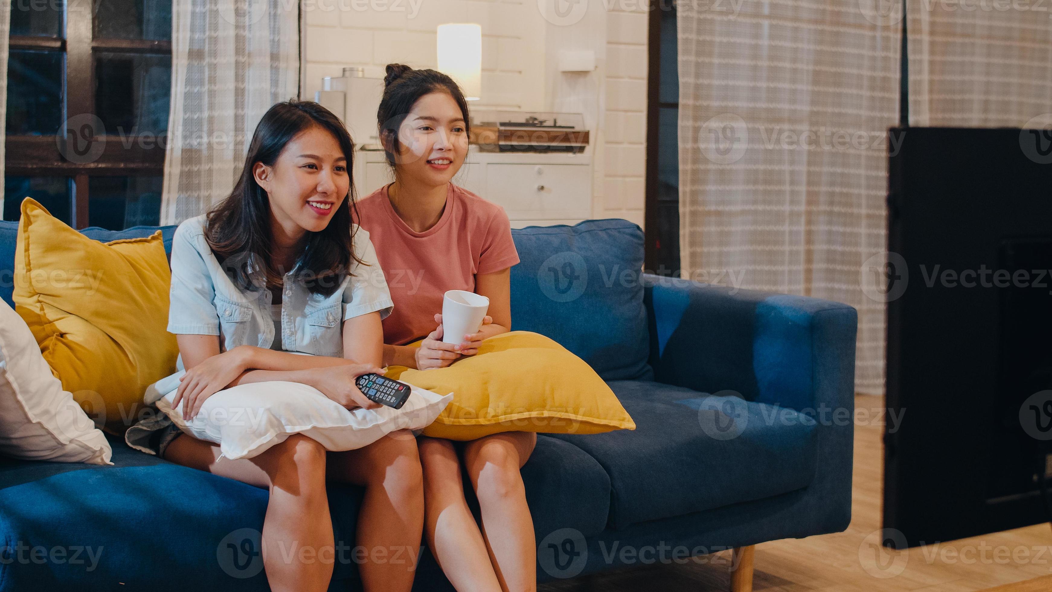 Lesbian Lgbt Women Couple Watching Television At Home Asian Female