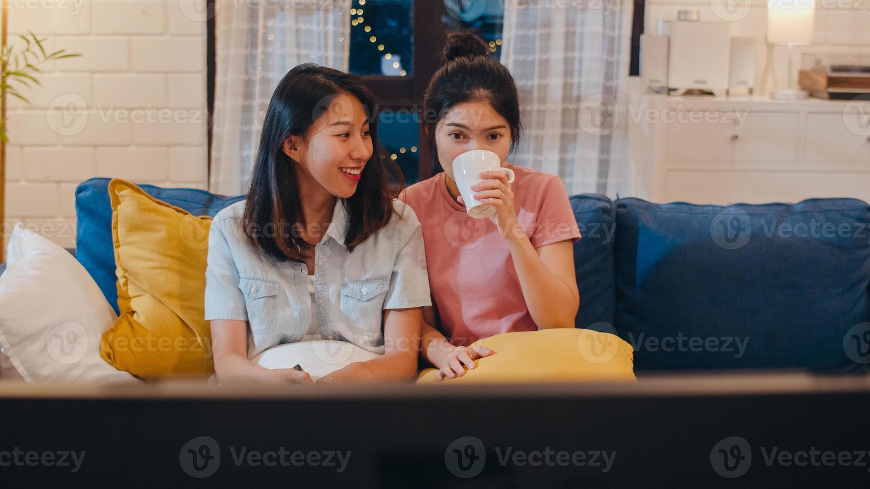 Lesbian Lgbt Women Couple Watching Television At Home Asian Female
