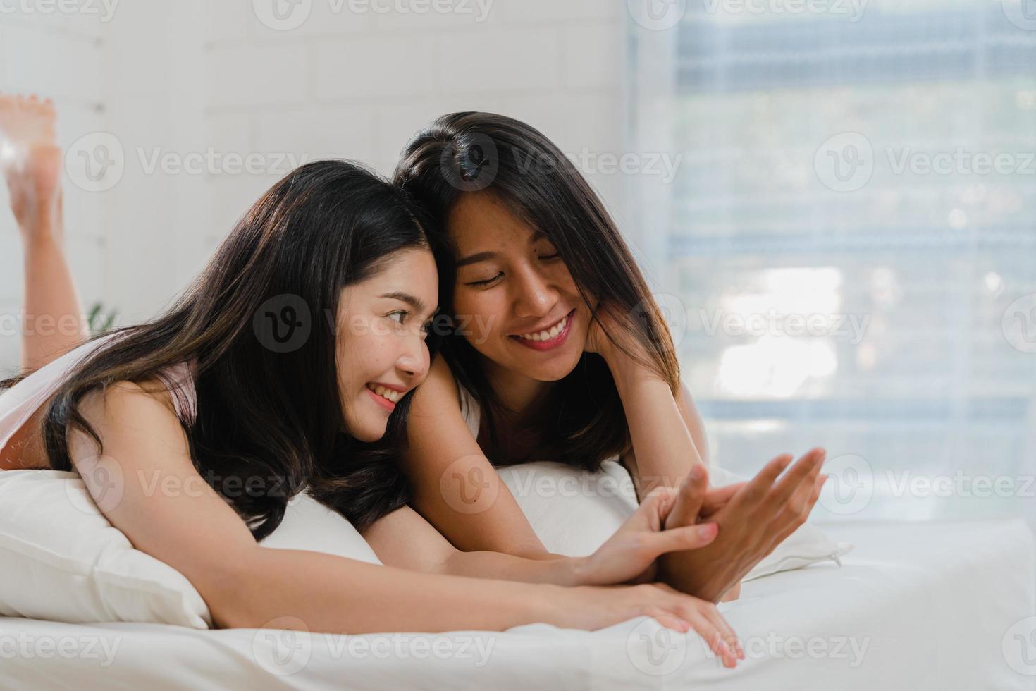 Asian Lesbian Lgbtq Women Couple Kiss And Hug On Bed At Home Young