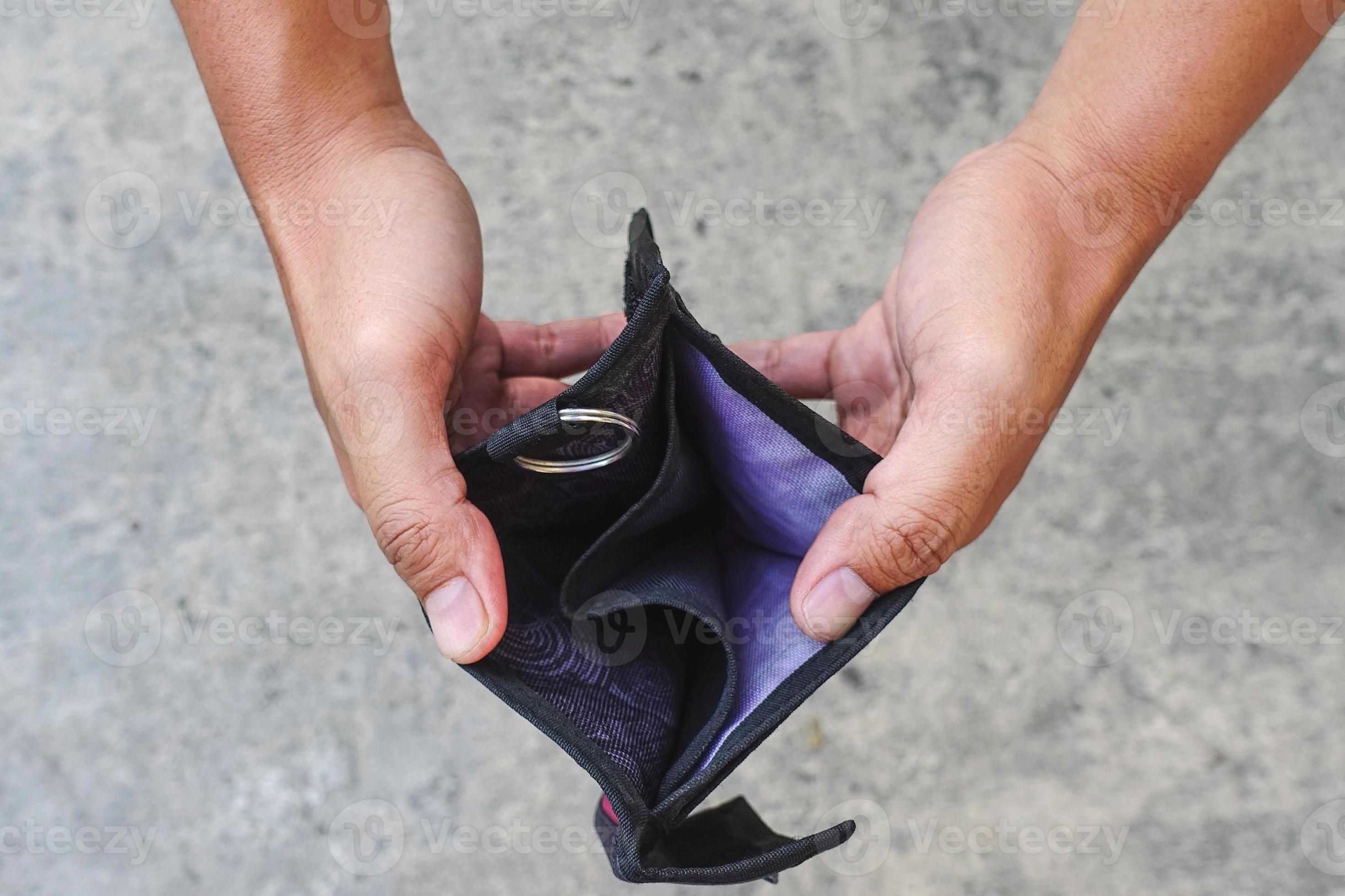Man hands holding an empty wallet. bankrupt concept image 5686270 Stock Photo at Vecteezy