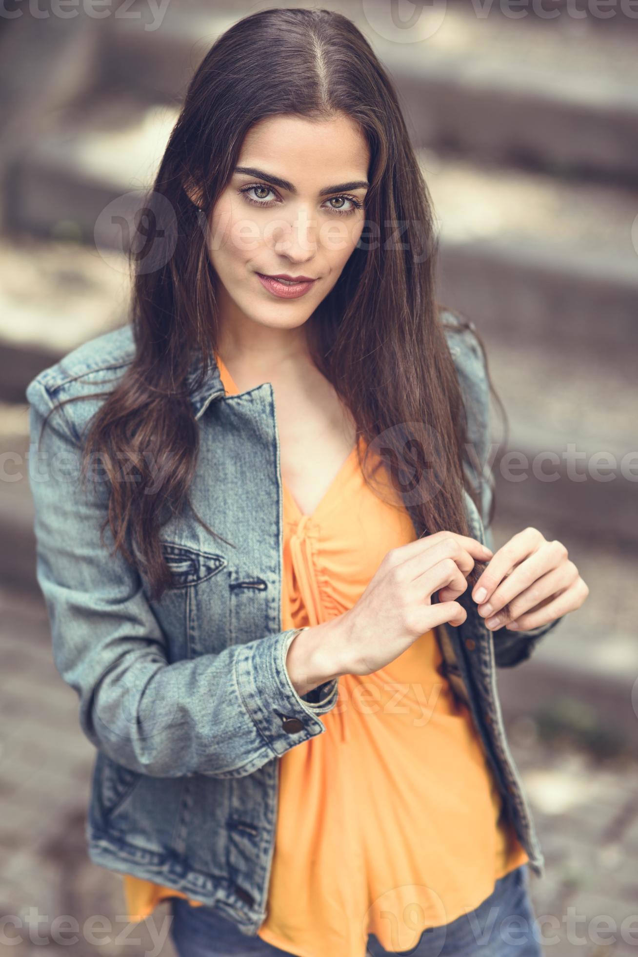 Woman With Nice Hair Wearing Casual Clothes In Urban Background