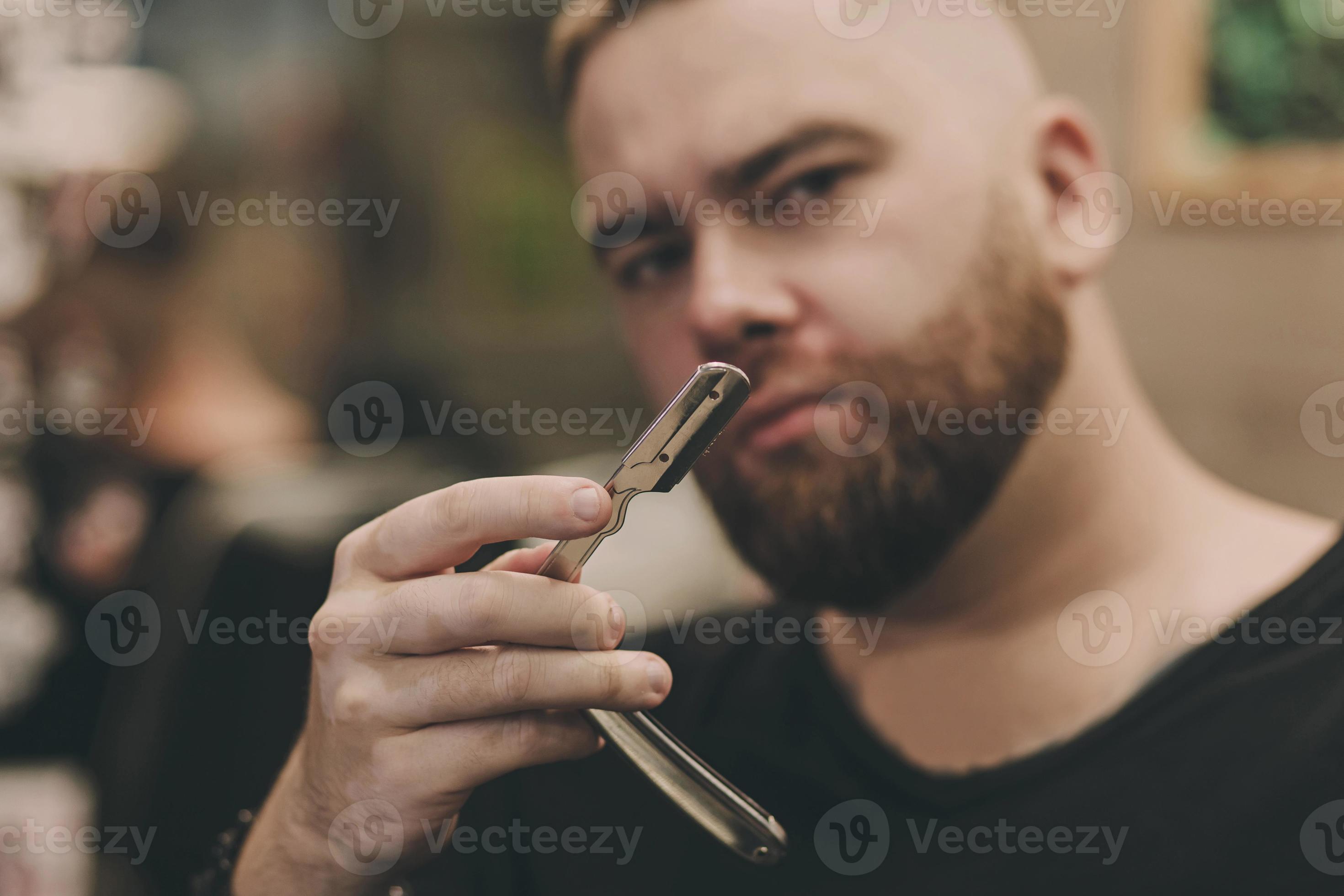 Bearded client visiting barber shop 5967004 Stock Photo at Vecteezy