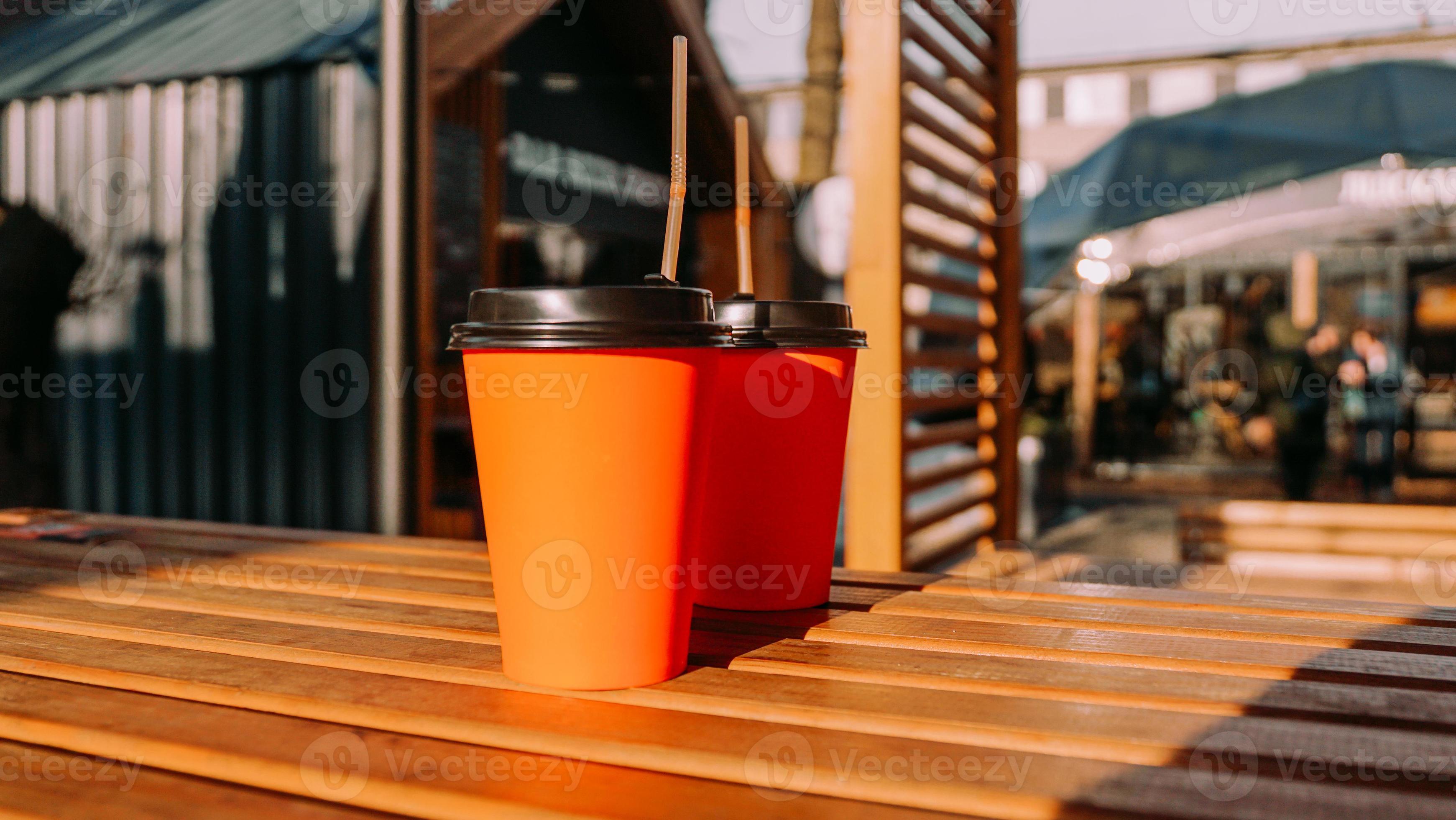 Orange paper coffee cups for take away on wood table. 6073495 Stock Photo at Vecteezy