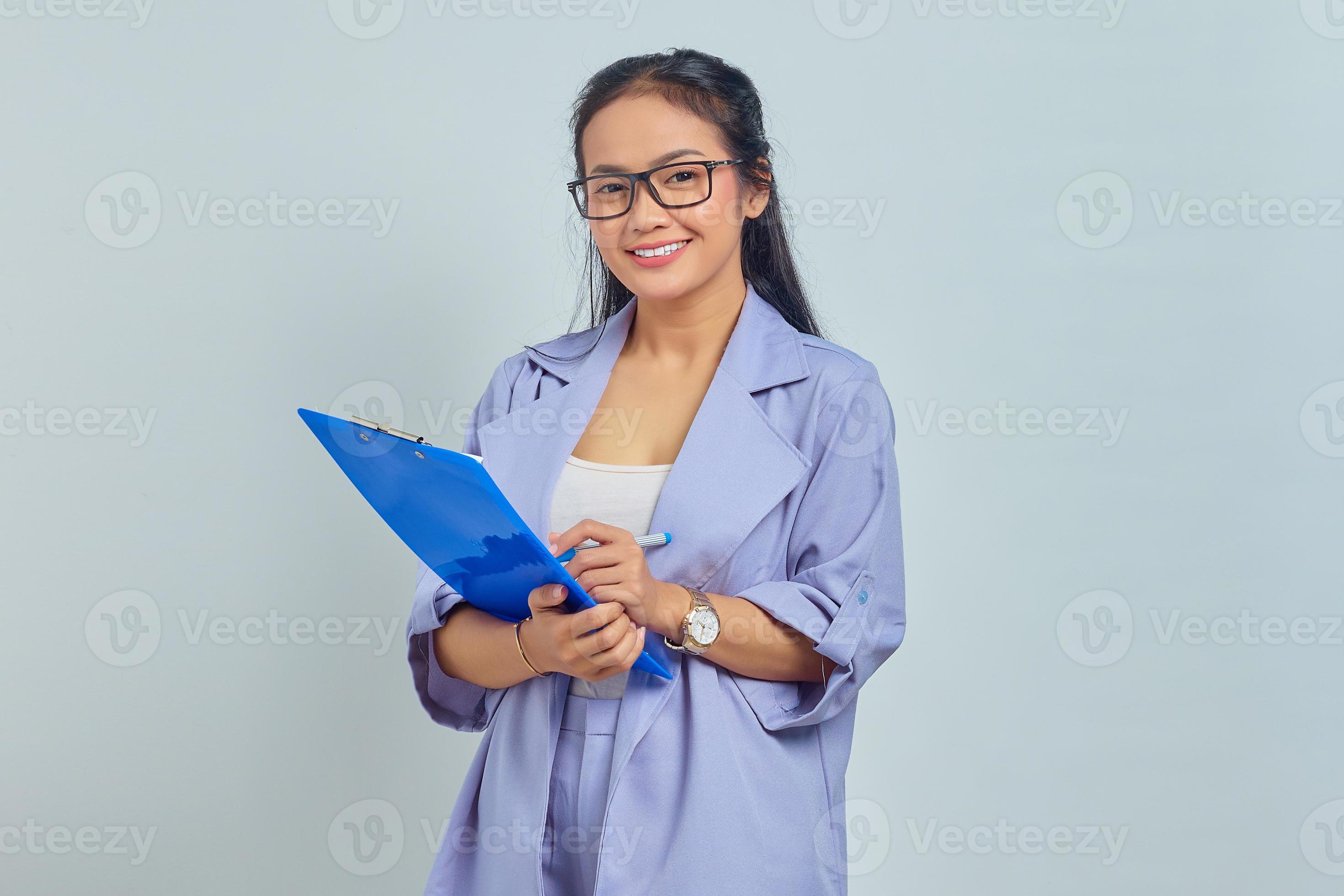 Young business woman holding clipboard, isolated on purple background ... Young business woman holding clipboard, isolated on purple background ...