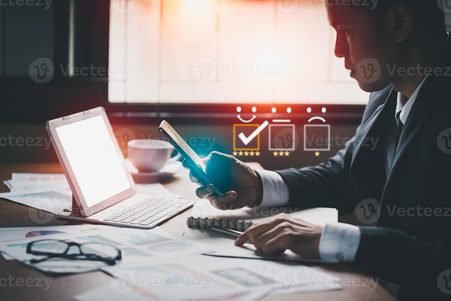 Businessman using mobile phone and pressing face emoticon smiling in ...