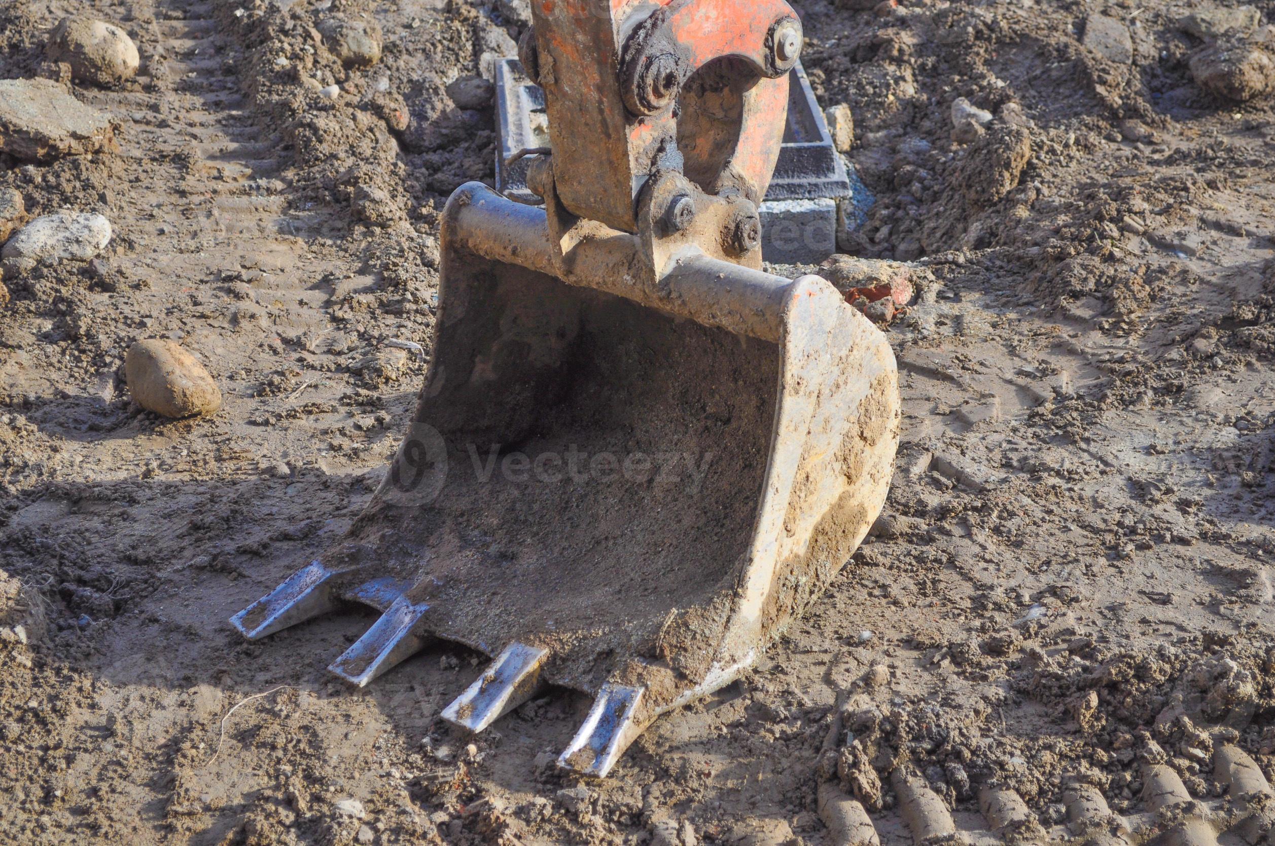 Excavator digging a hole 6840353 Stock Photo at Vecteezy