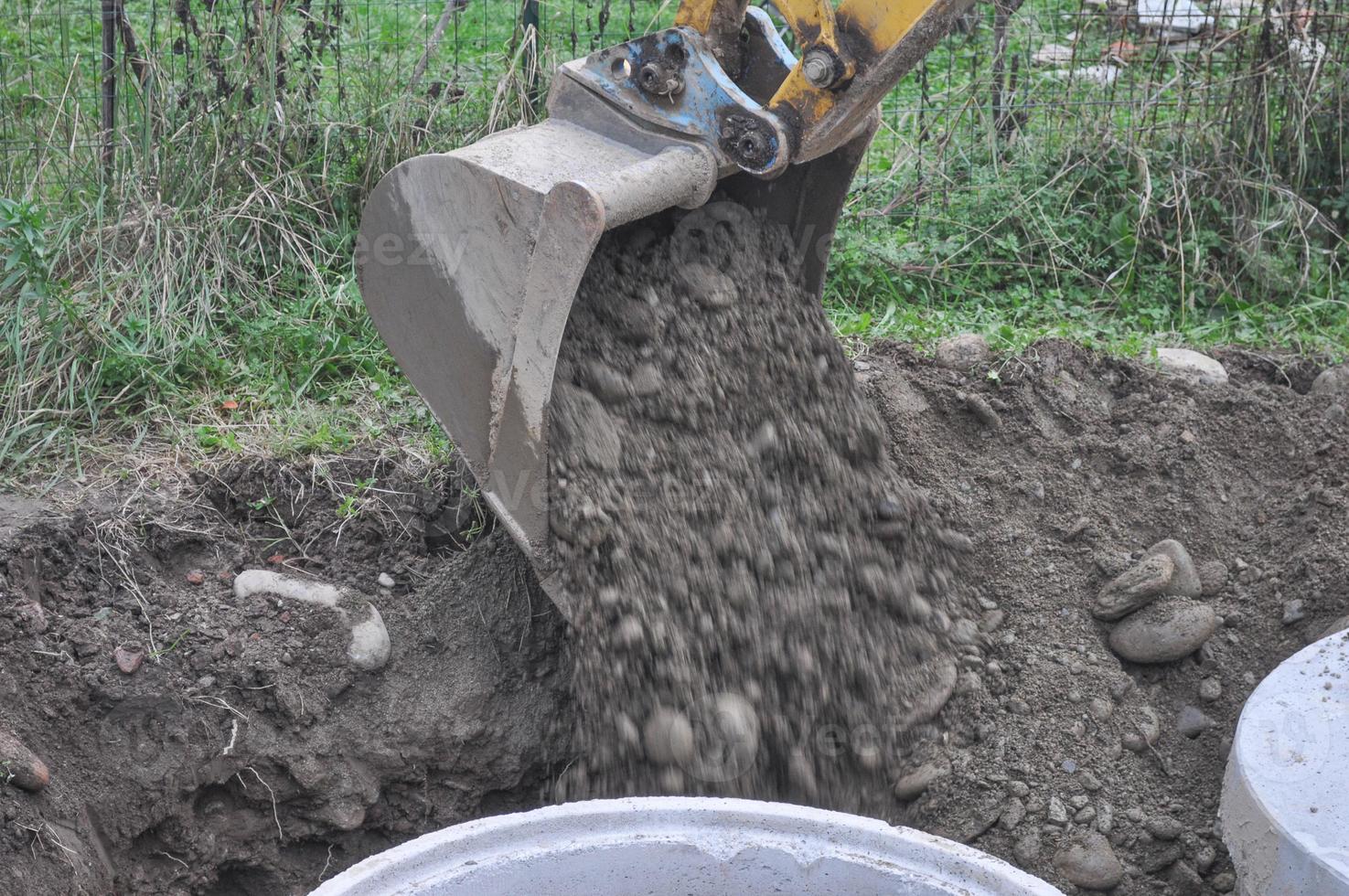 Excavator digging a hole 7020373 Stock Photo at Vecteezy