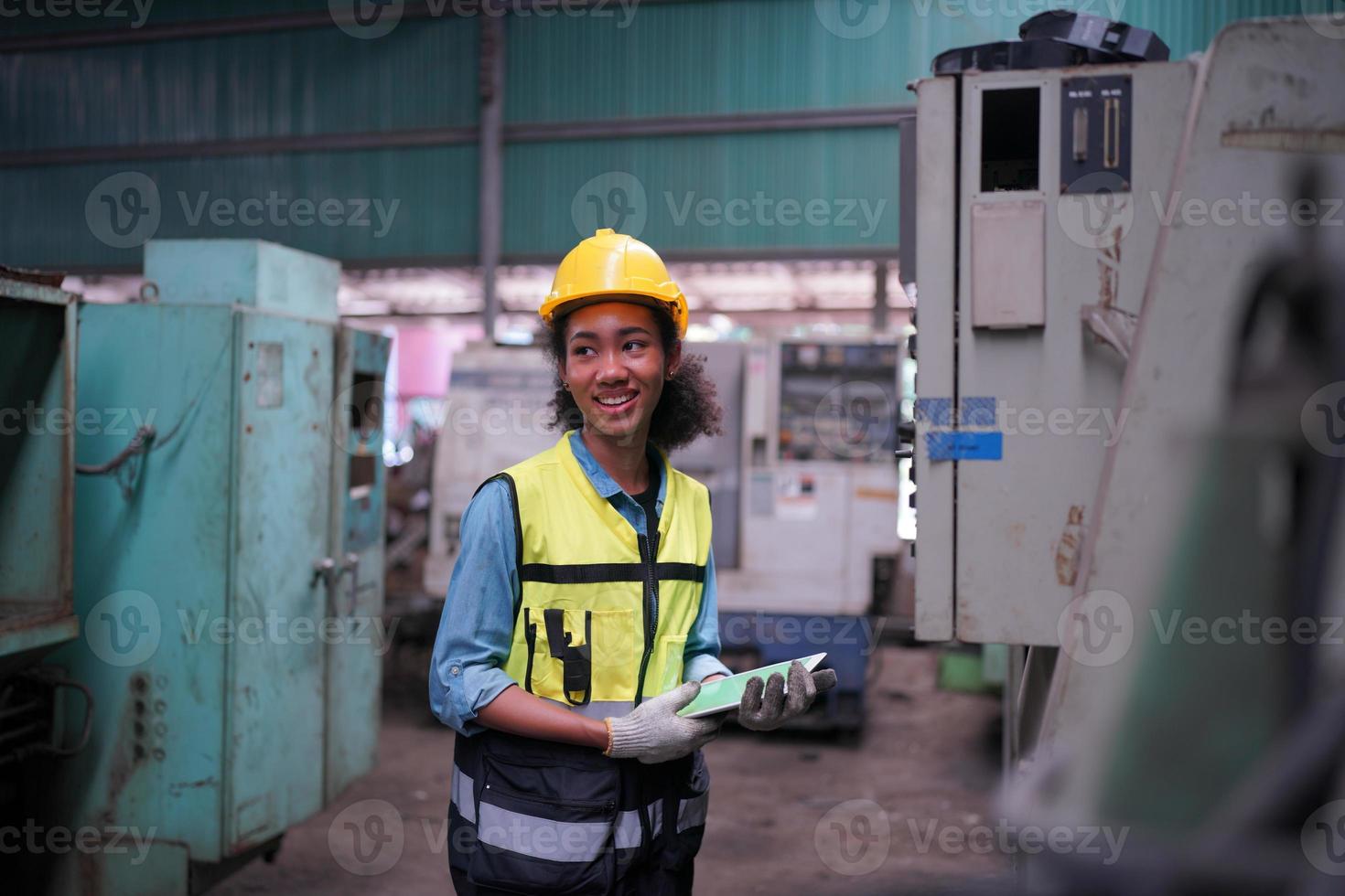 Female Maintenance Engineers is working in front of the automated CNC ... Female Maintenance Engineers is working in front of the automated CNC ...
