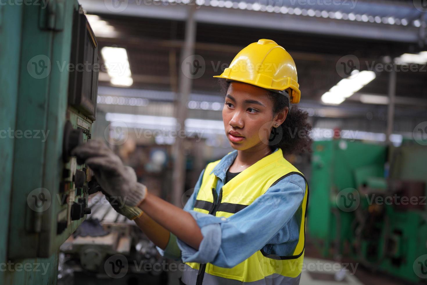 Female Maintenance Engineers is working in front of the automated CNC ... Female Maintenance Engineers is working in front of the automated CNC ...