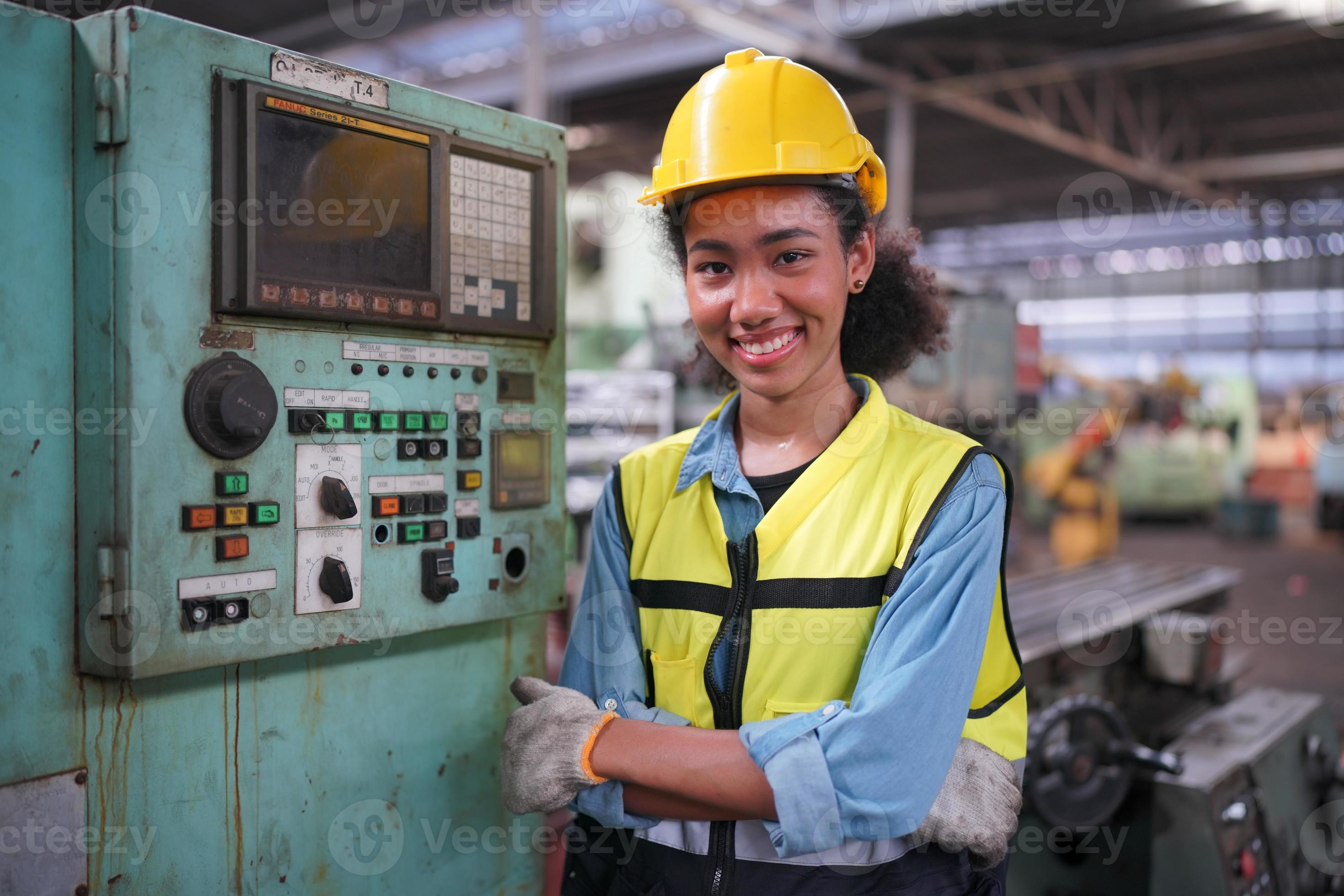 Female Maintenance Engineers is working in front of the automated CNC ... Female Maintenance Engineers is working in front of the automated CNC ...