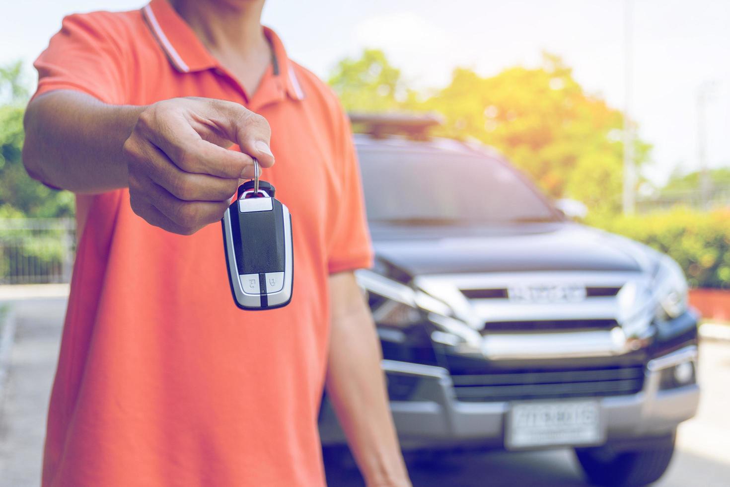 Man holding car keys with car on background 7184076 Stock Photo at Vecteezy Man holding car keys with car on background 7184076 Stock Photo at Vecteezy