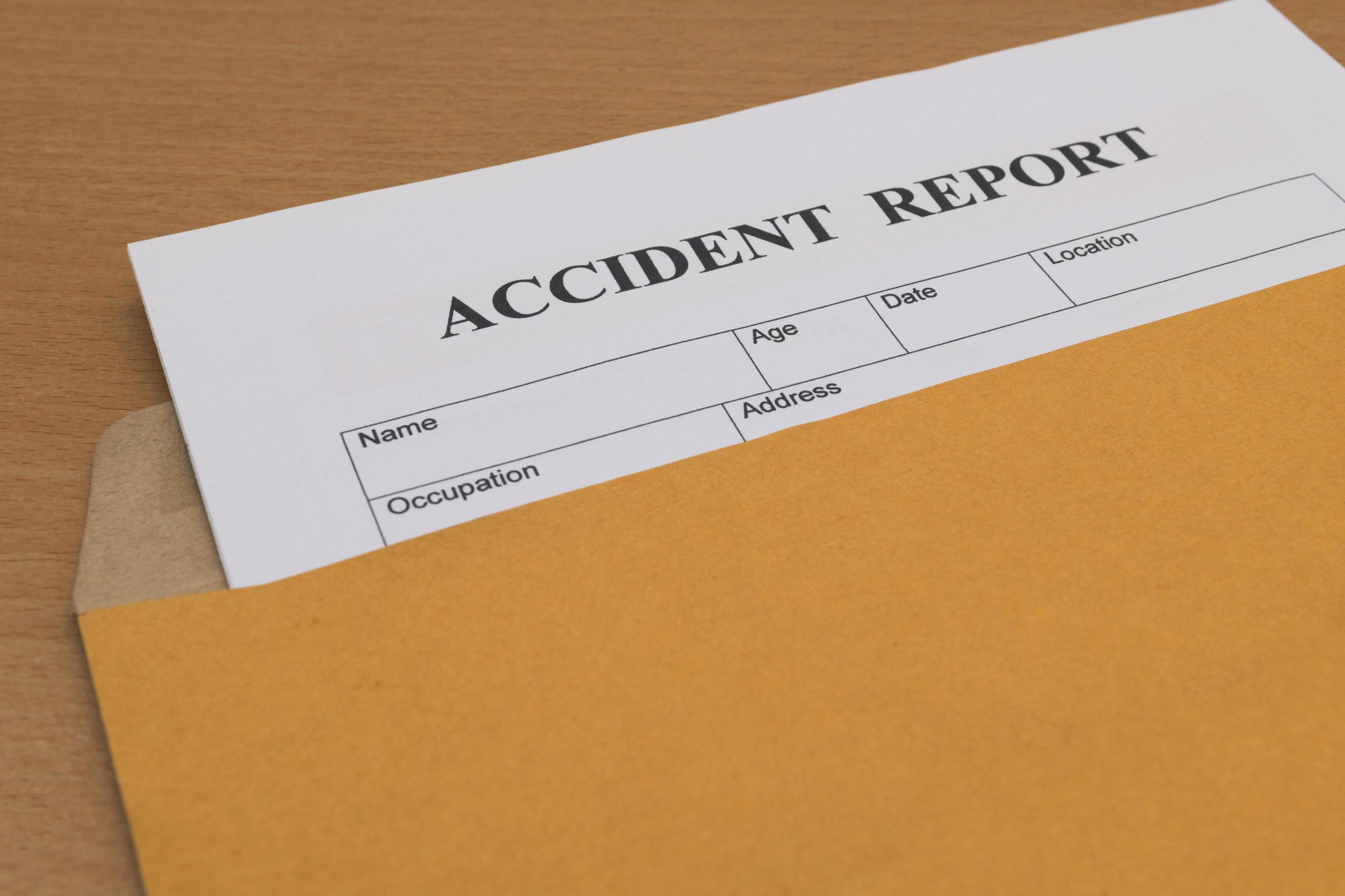 Accident report form on brown envelope 7205528 Stock Photo at Vecteezy
