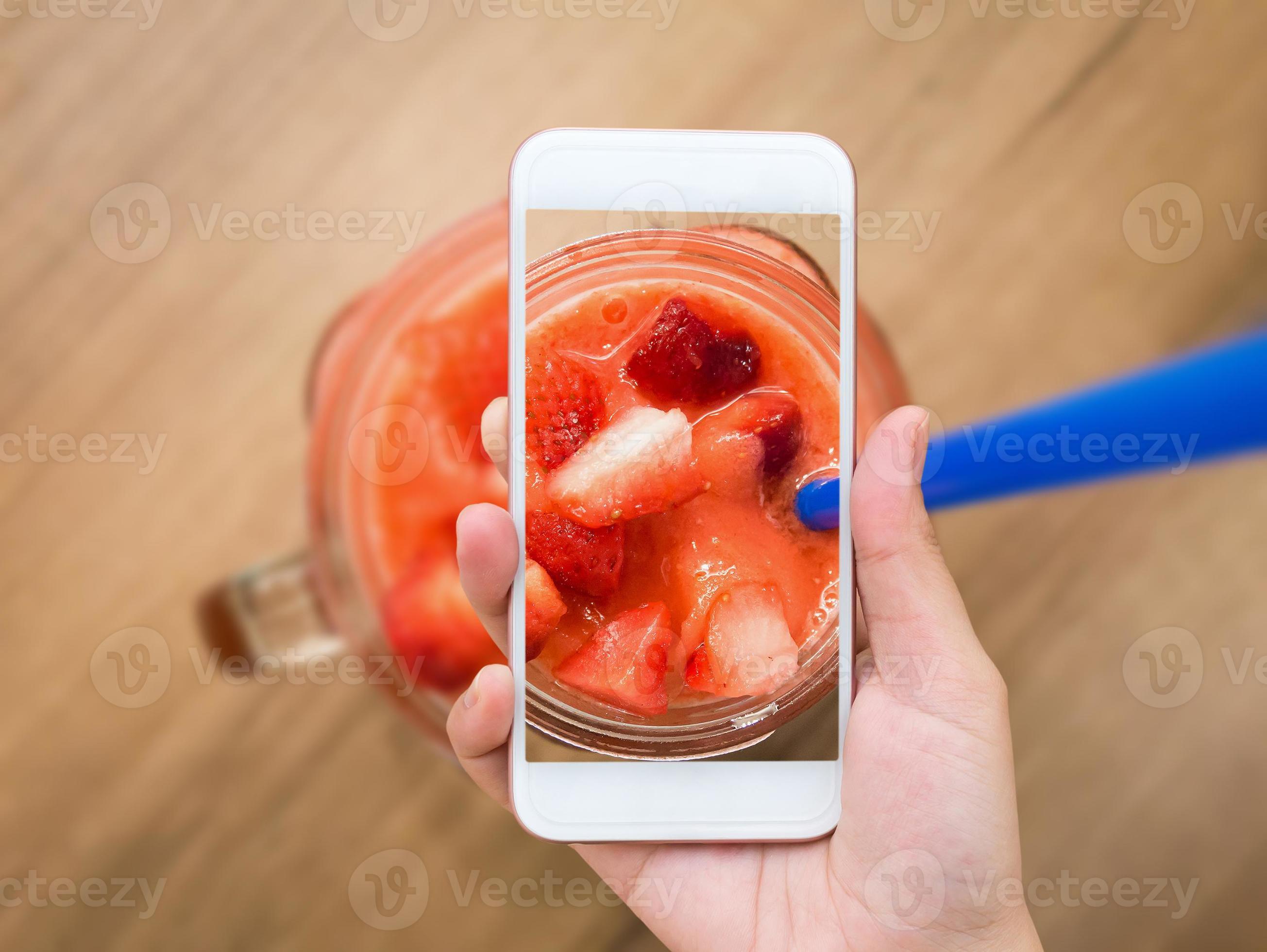 Female Hand Taking Photo Of Fresh Strawberry Smoothie 7305954 Stock